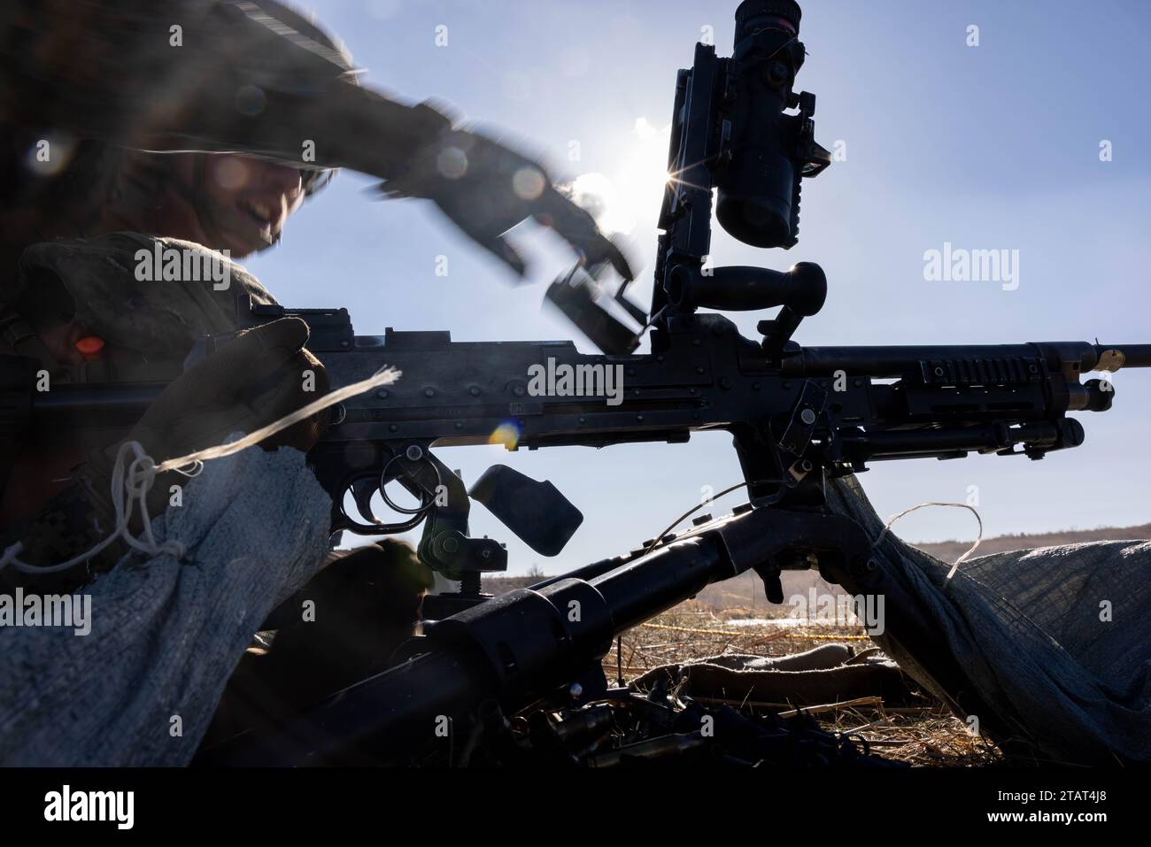 A U.S. Marine clears an M240B machine gun during Artillery Relocation ...