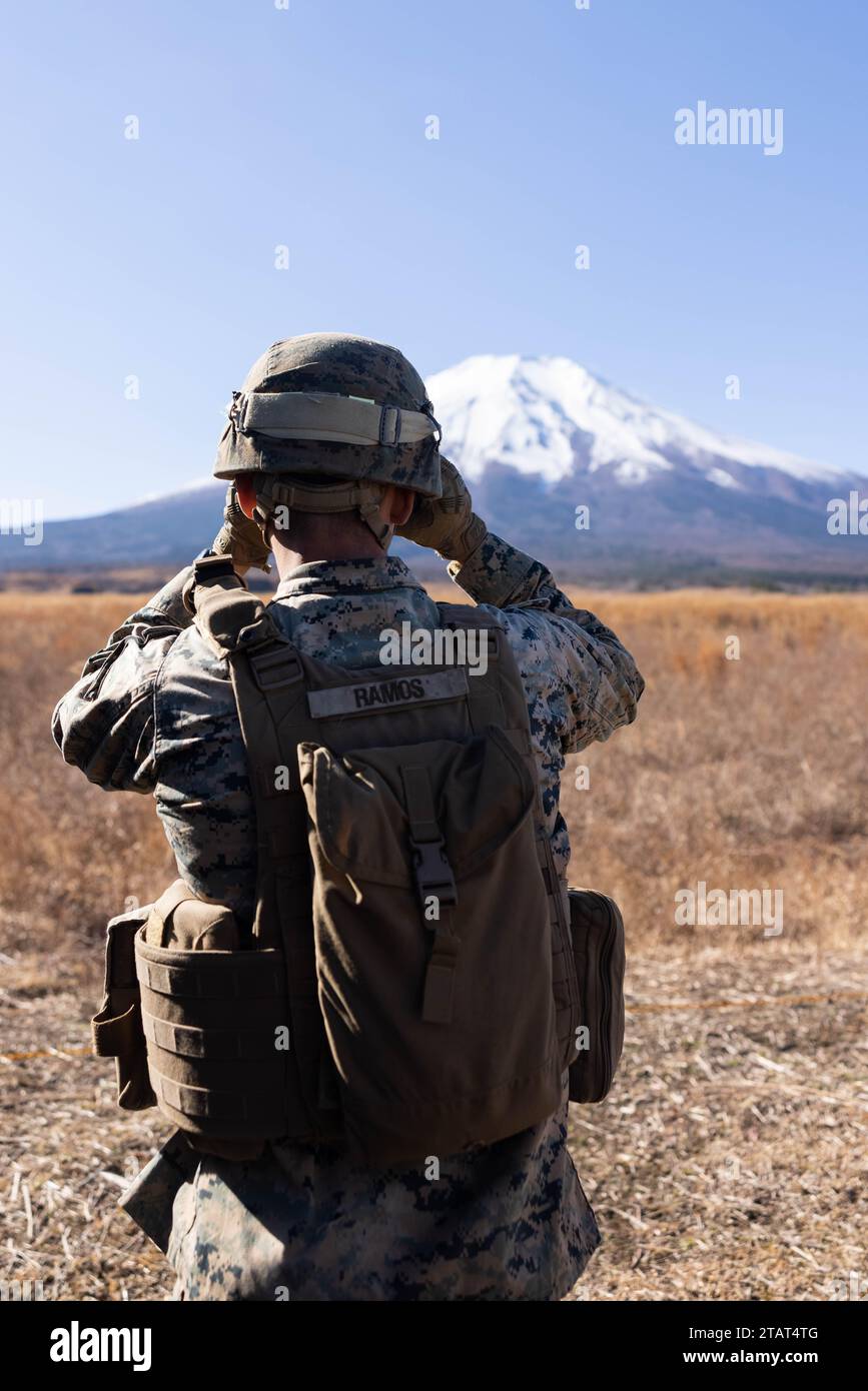 U.S. Marine Corps Cpl. Connor Ramos observes targets during an M240B ...