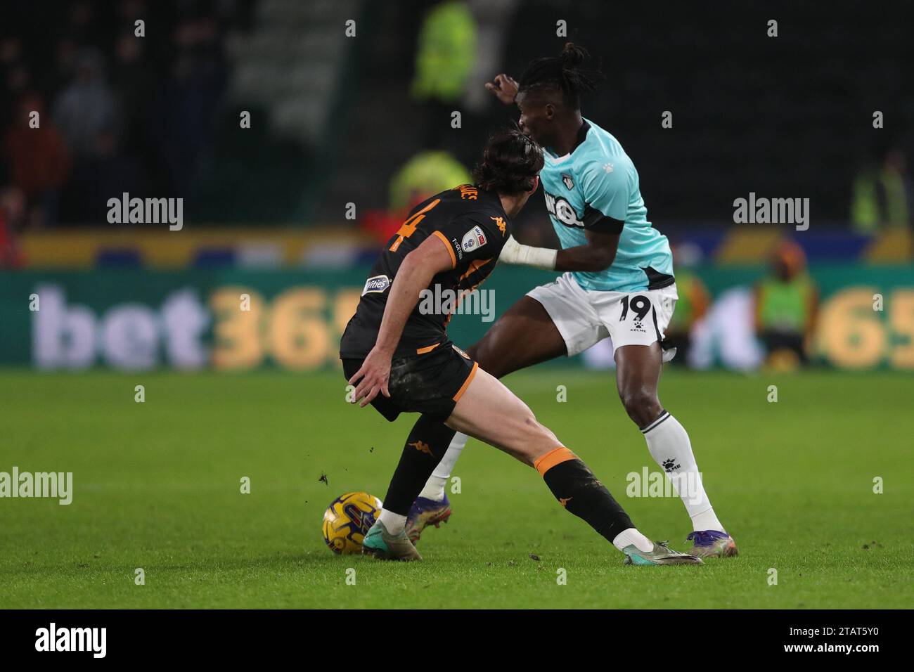 Vakoun Issouf Bayo of Watford in action with Jacob Greaves heads clear ...