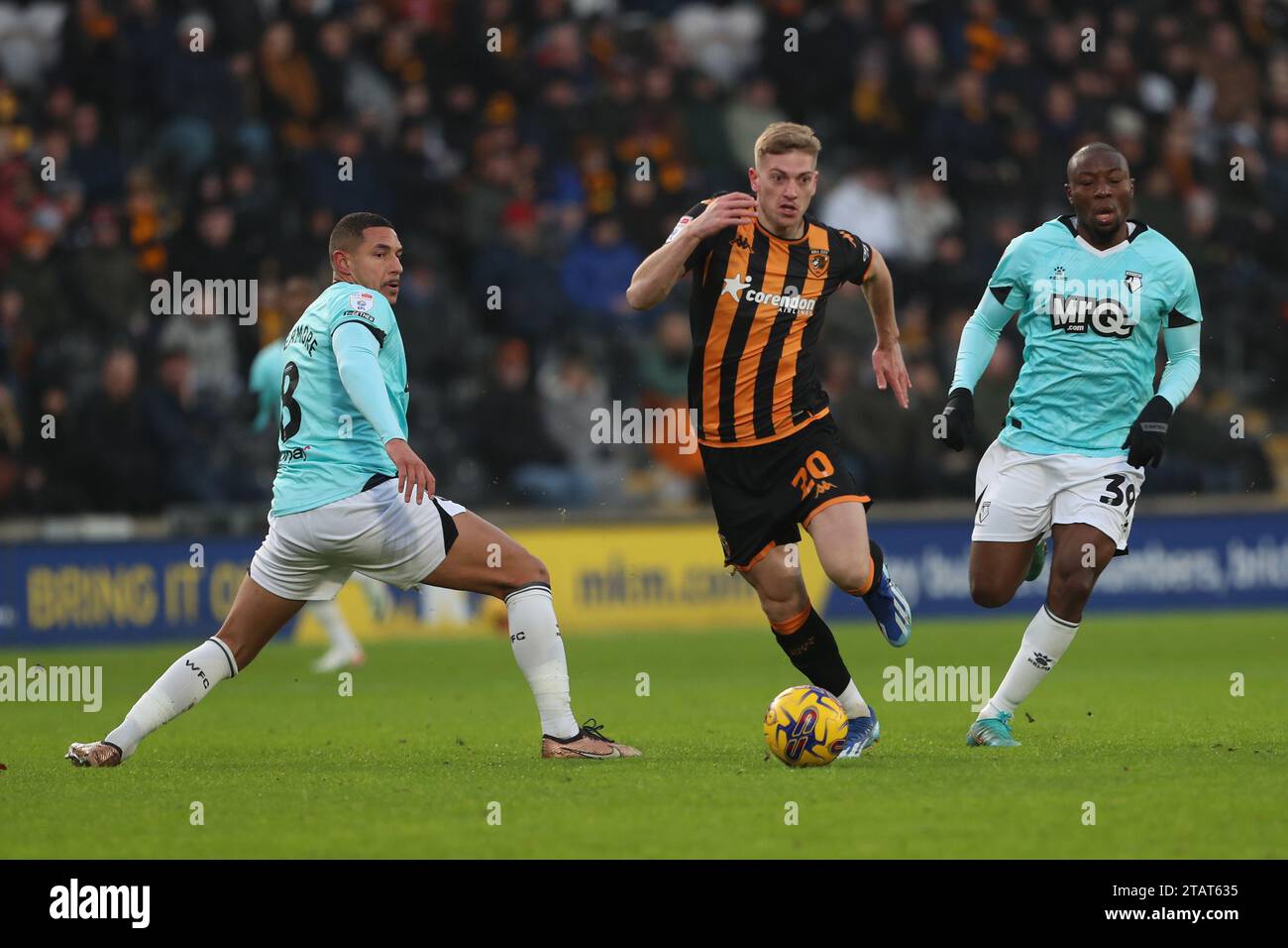 Hull City's Liam Delap in action with Watford's Jake Livermore and Edo ...