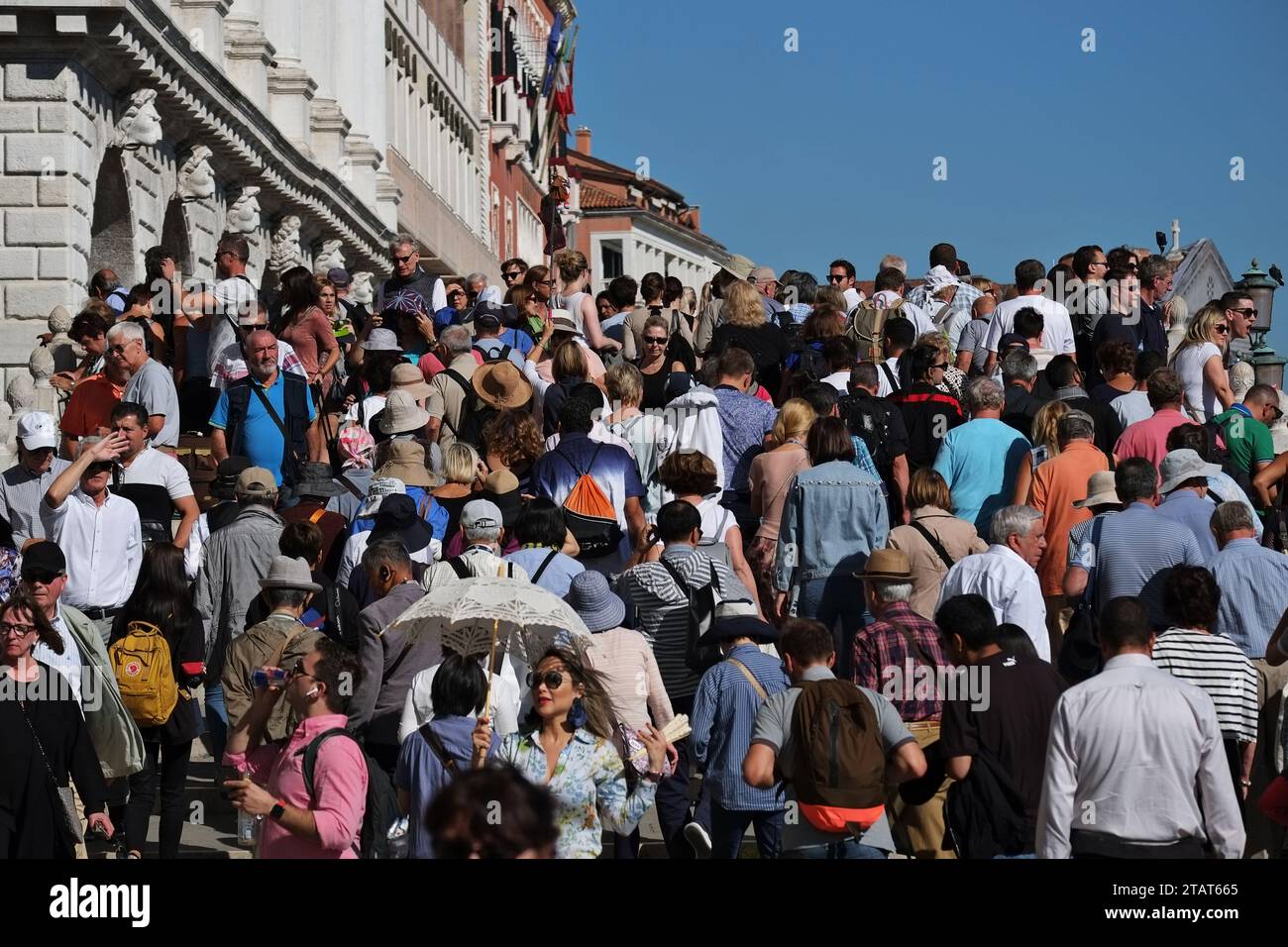 Overtourism Venice, busy tourists crowd Ponte della Paglia on busy Riva ...