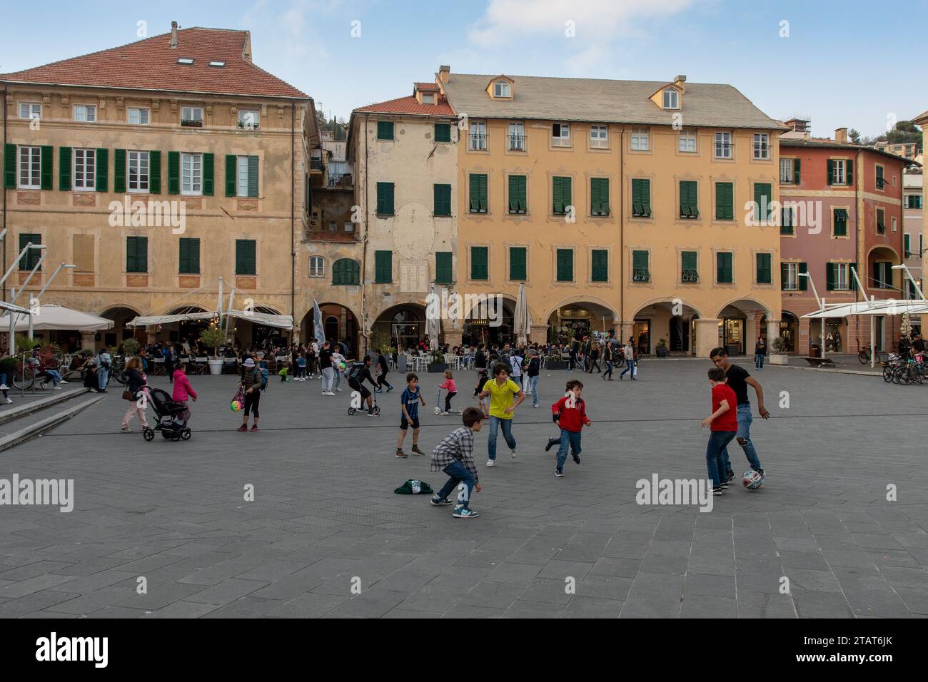 Children playing soccer in Piazza Vittorio Emanuele II, the main square ...