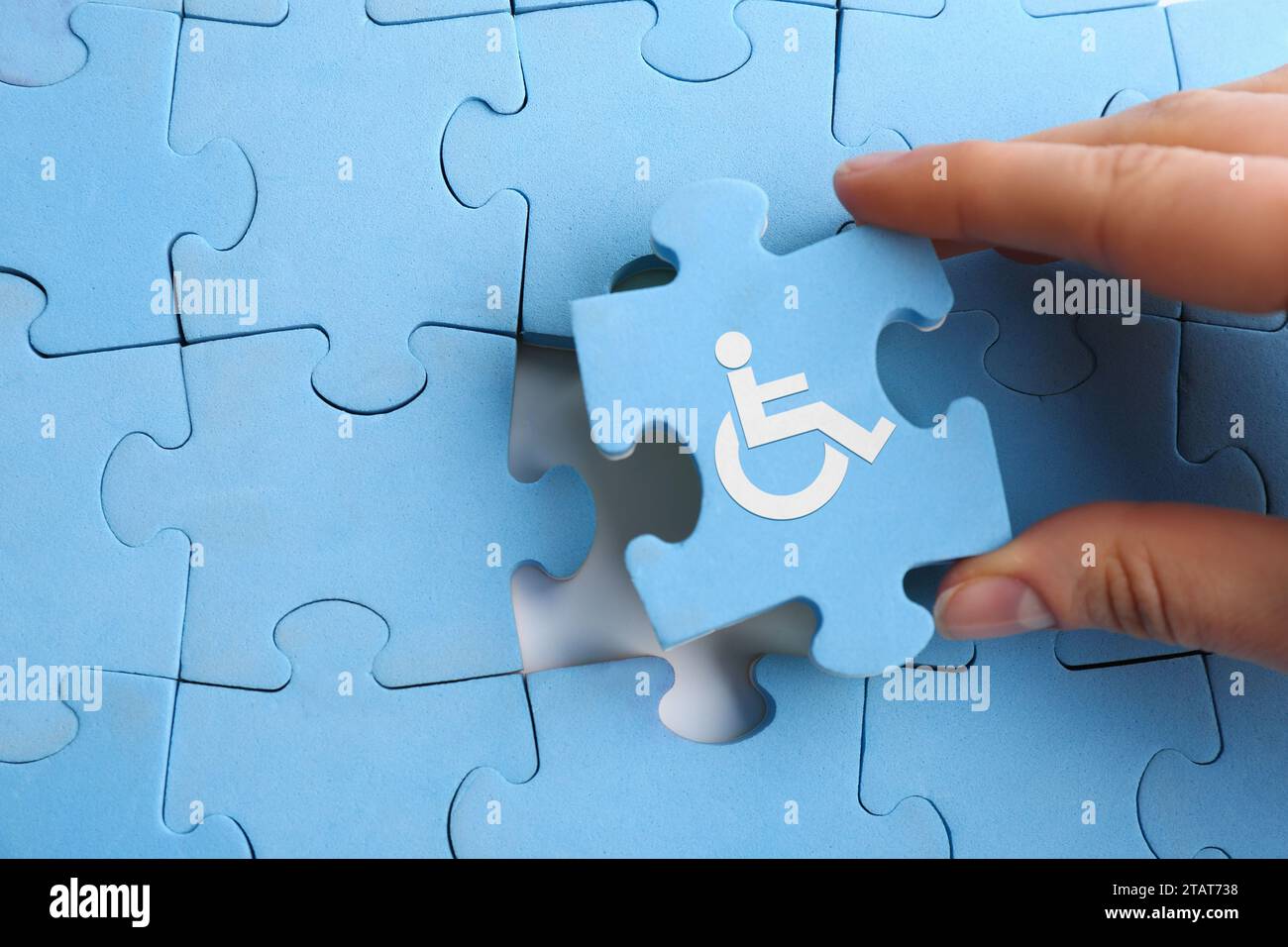 Inclusion concept. Woman putting light blue puzzle with international ...