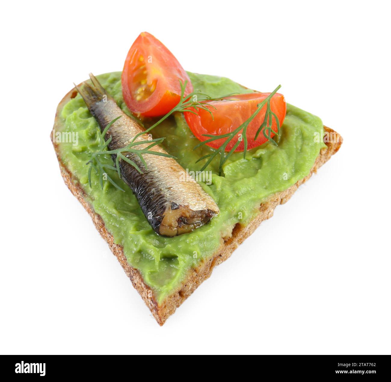 Delicious sandwich with sprat, tomato, avocado puree and dill isolated ...