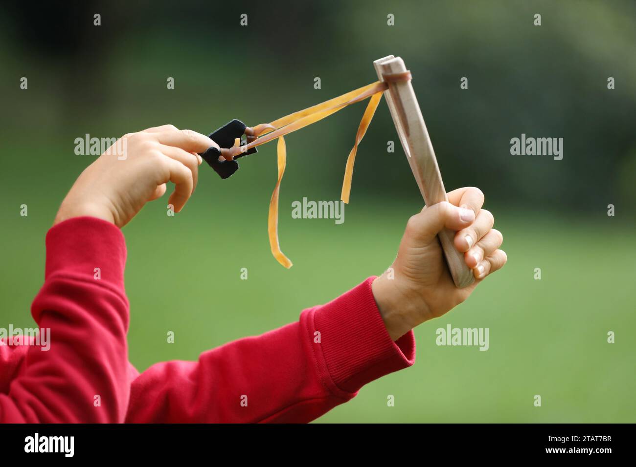 Little boy playing with slingshot outdoors, closeup Stock Photo - Alamy