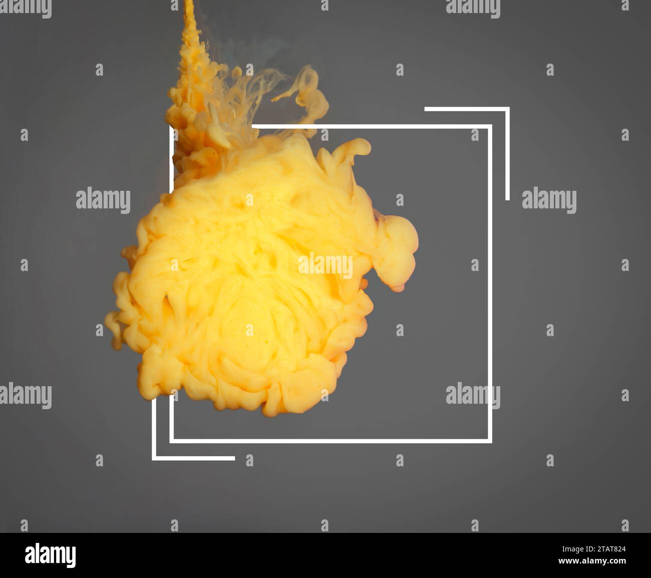 Splash of yellow ink and frame on grey background Stock Photo - Alamy