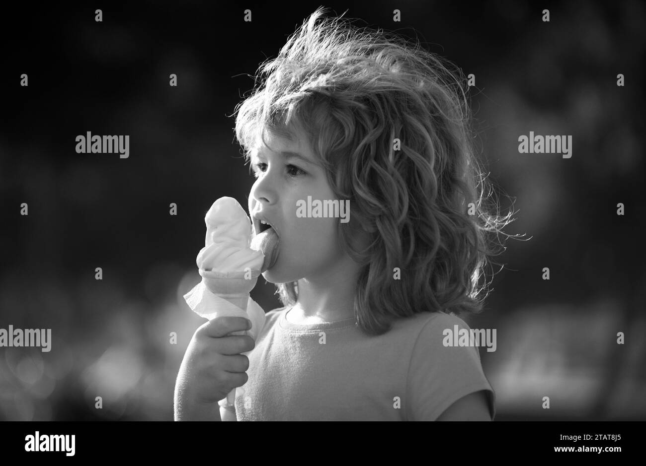 Close up head shot of child eating ice cream. Kids face, little boy ...