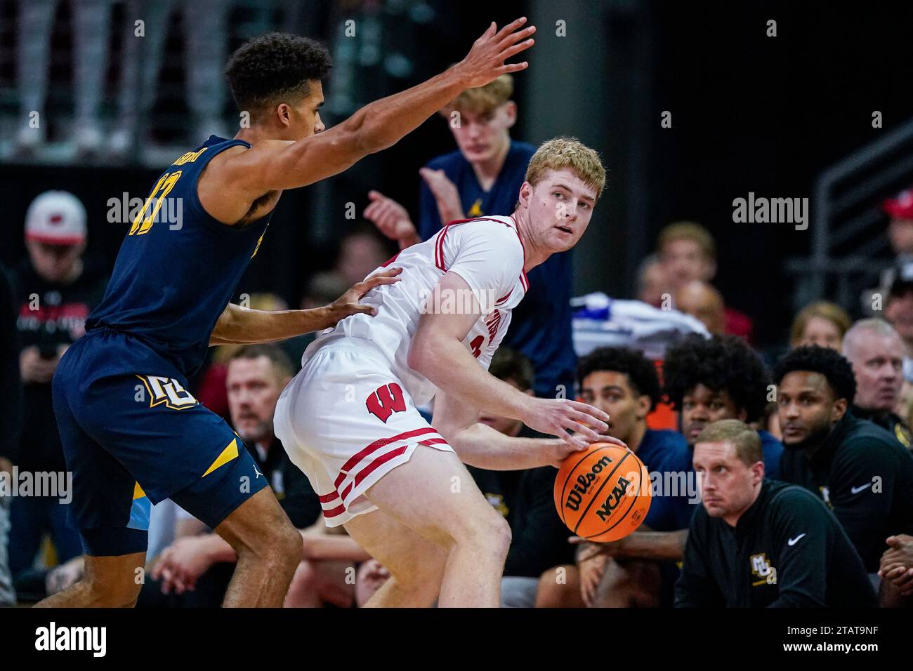 Wisconsin's Steven Crowl (22) against Marquette's David Joplin (23 ...