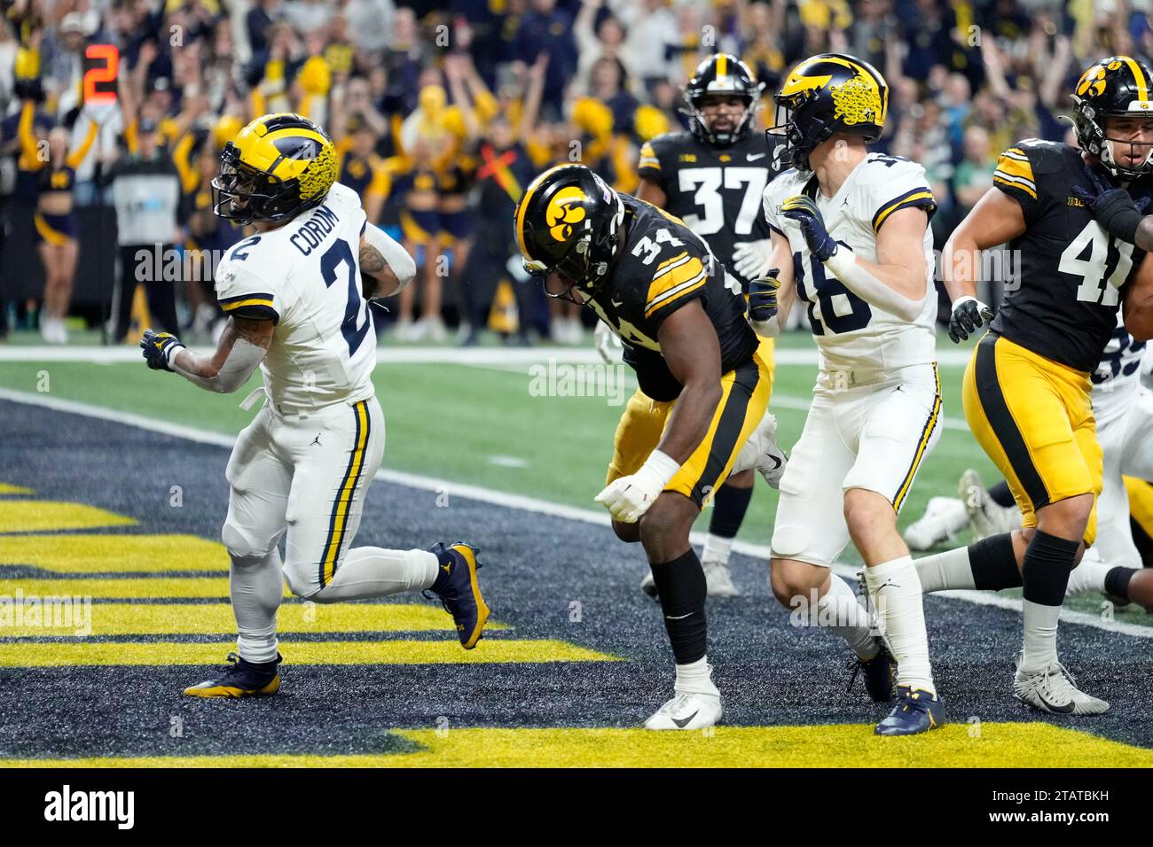 Michigan running back Blake Corum (2) scores on a 2-yard touchdown run ...
