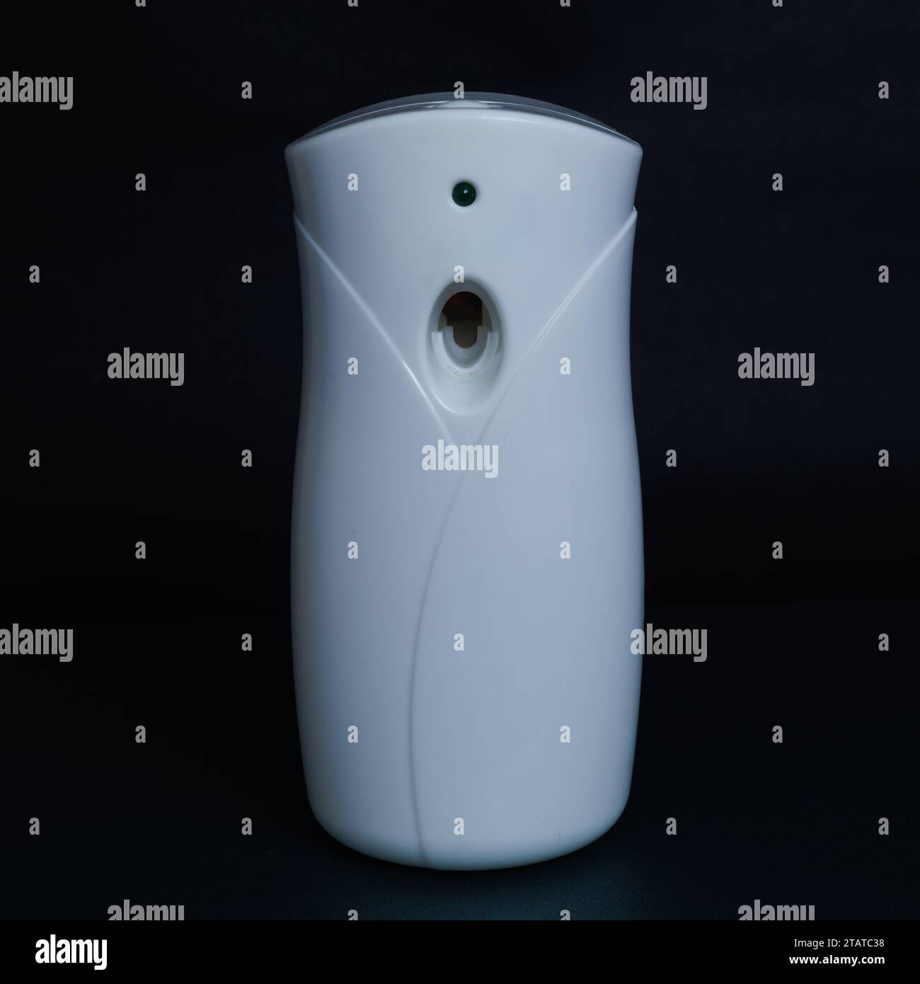 Automatic air freshener isolated on black Stock Photo - Alamy