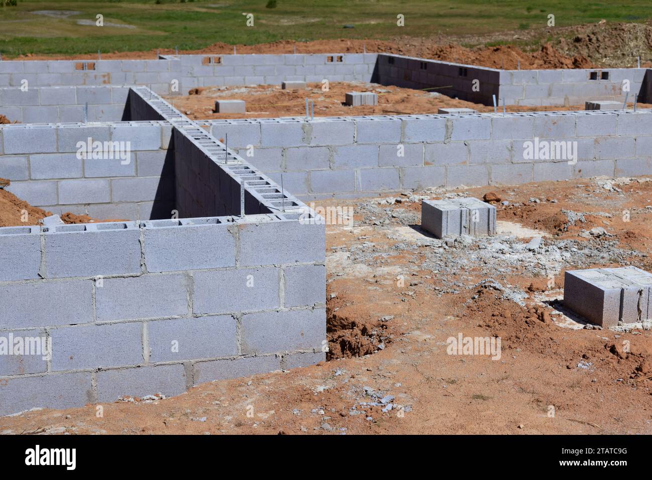 At construction site, cement blocks support foundation for wall of ...