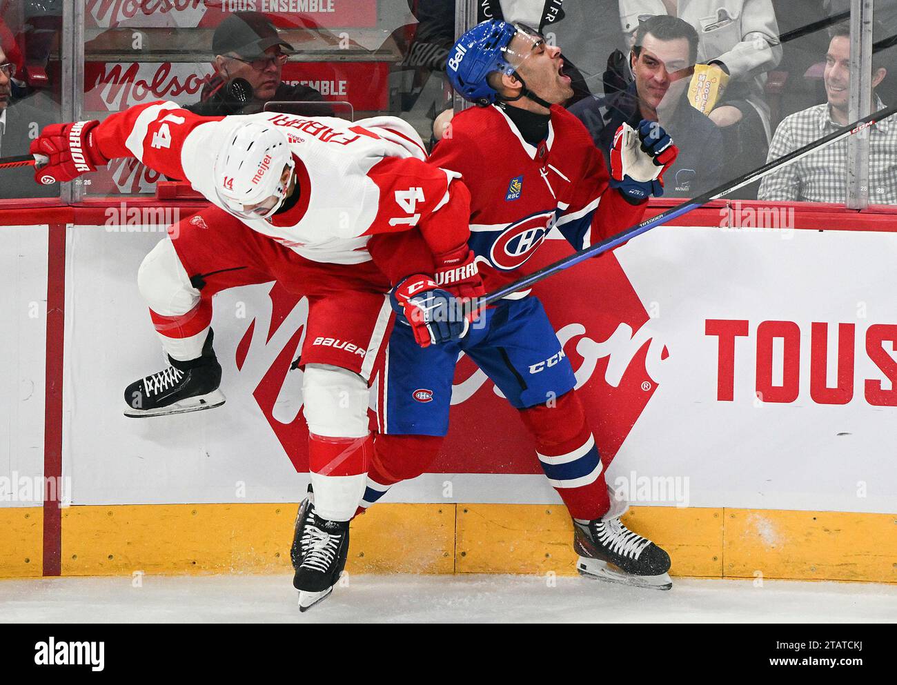 Detroit Red Wings' Robby Fabbri (14) checks Montreal Canadiens' Jayden ...