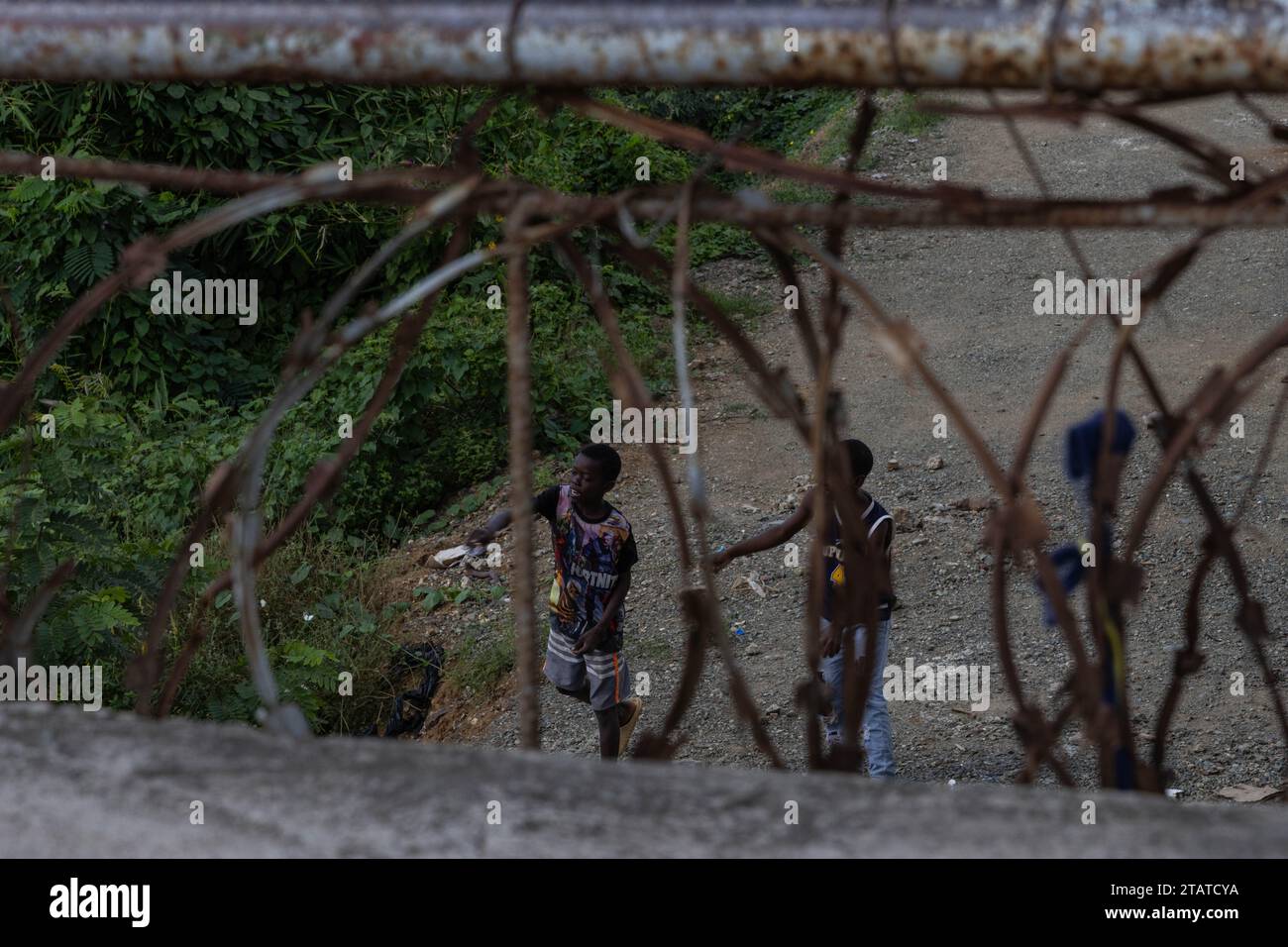 Haitian boys play on the bank of the Dominican side of the Massacre ...