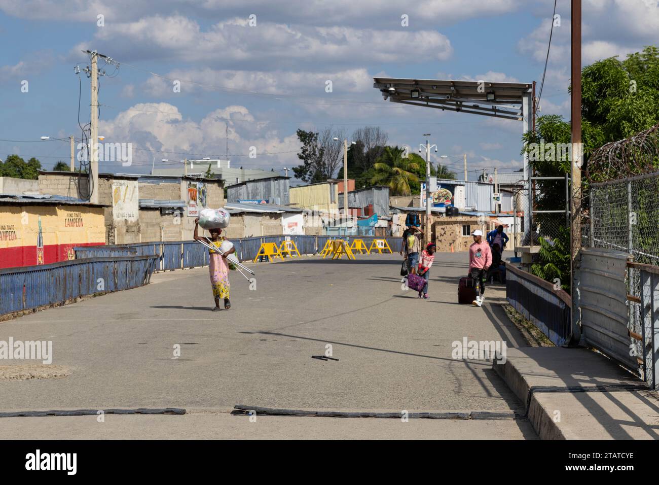 Haitians walk towards the border between the Dominican Republic and ...