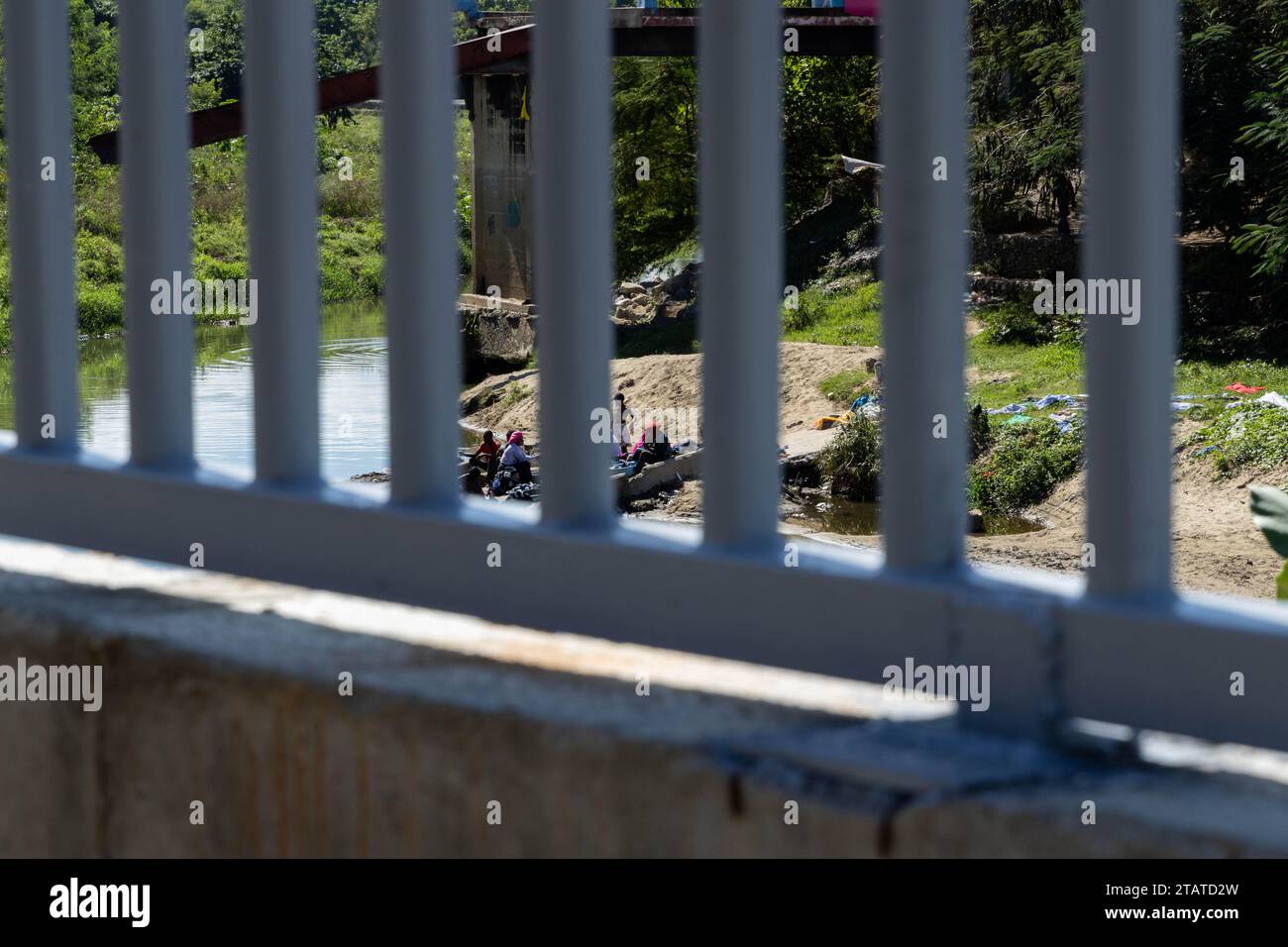 Haitians wash their clothes in the Massacre River, the natural border ...