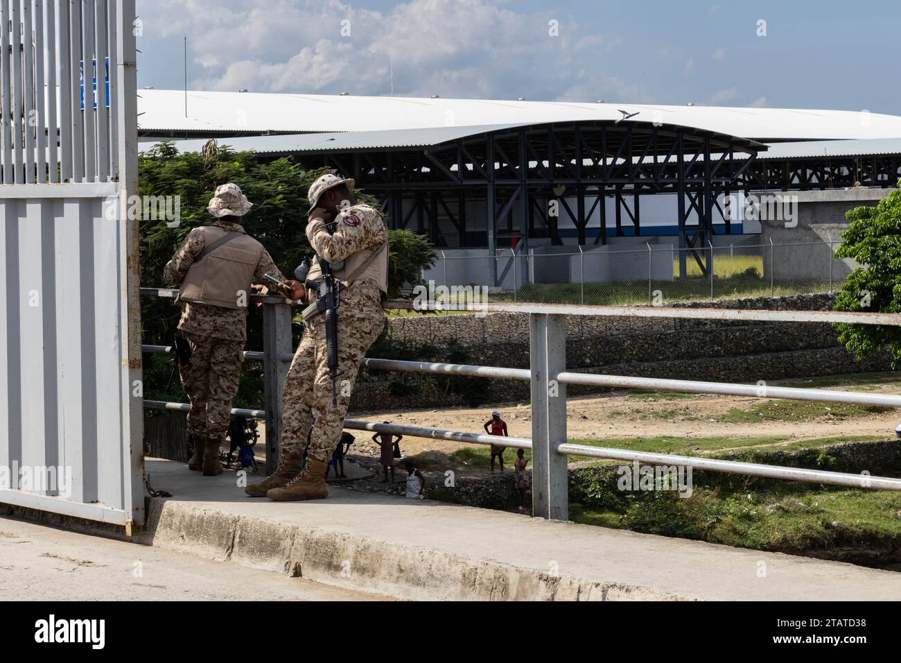 Soldiers stand guard at the Dominican Republic and Haiti border ...