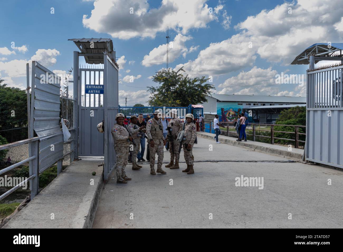 Soldiers stand guard at the Dominican Republic-Haiti border in Dajabón ...