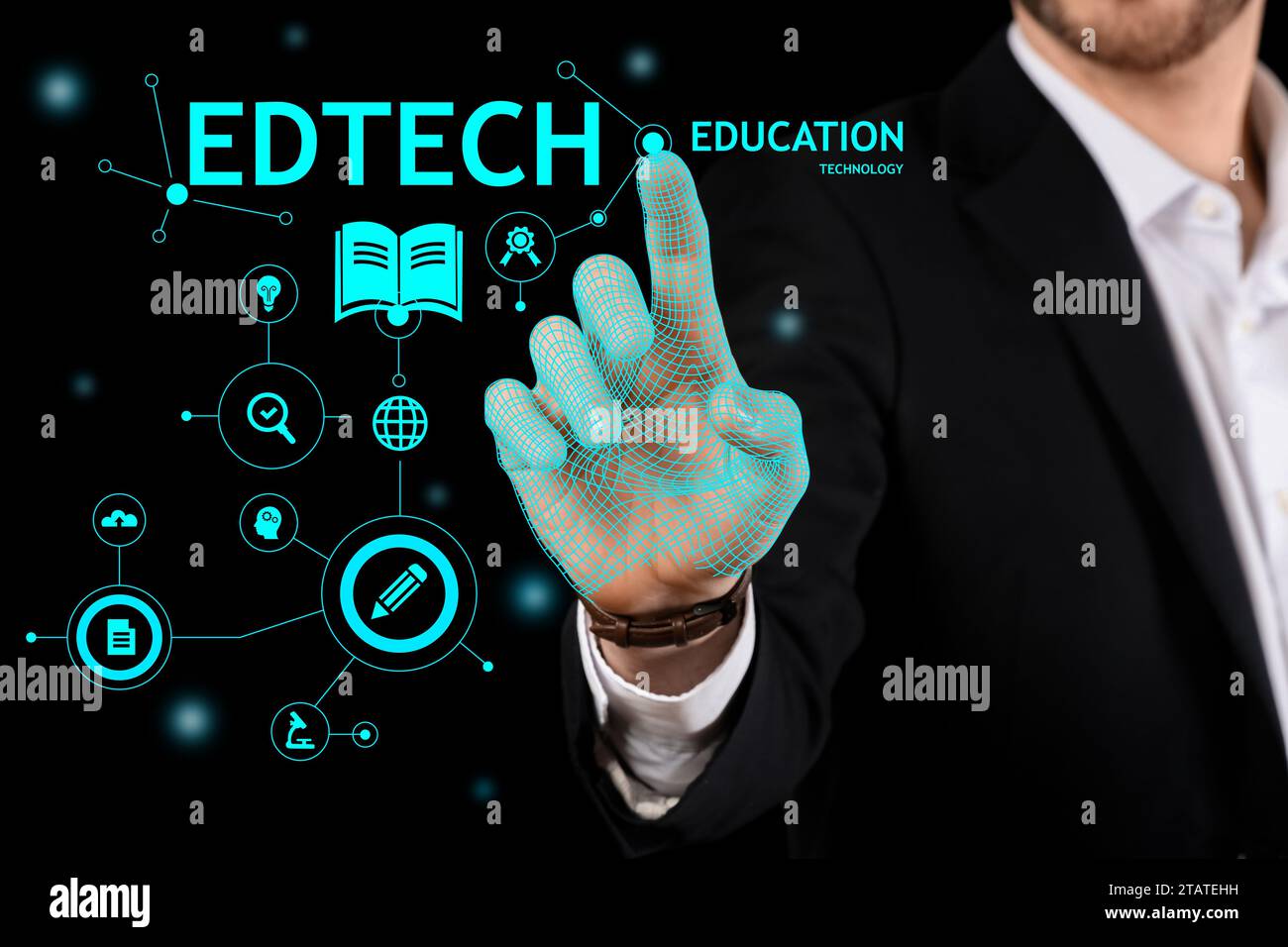 Man using virtual screen with text EDTECH on dark background Stock ...