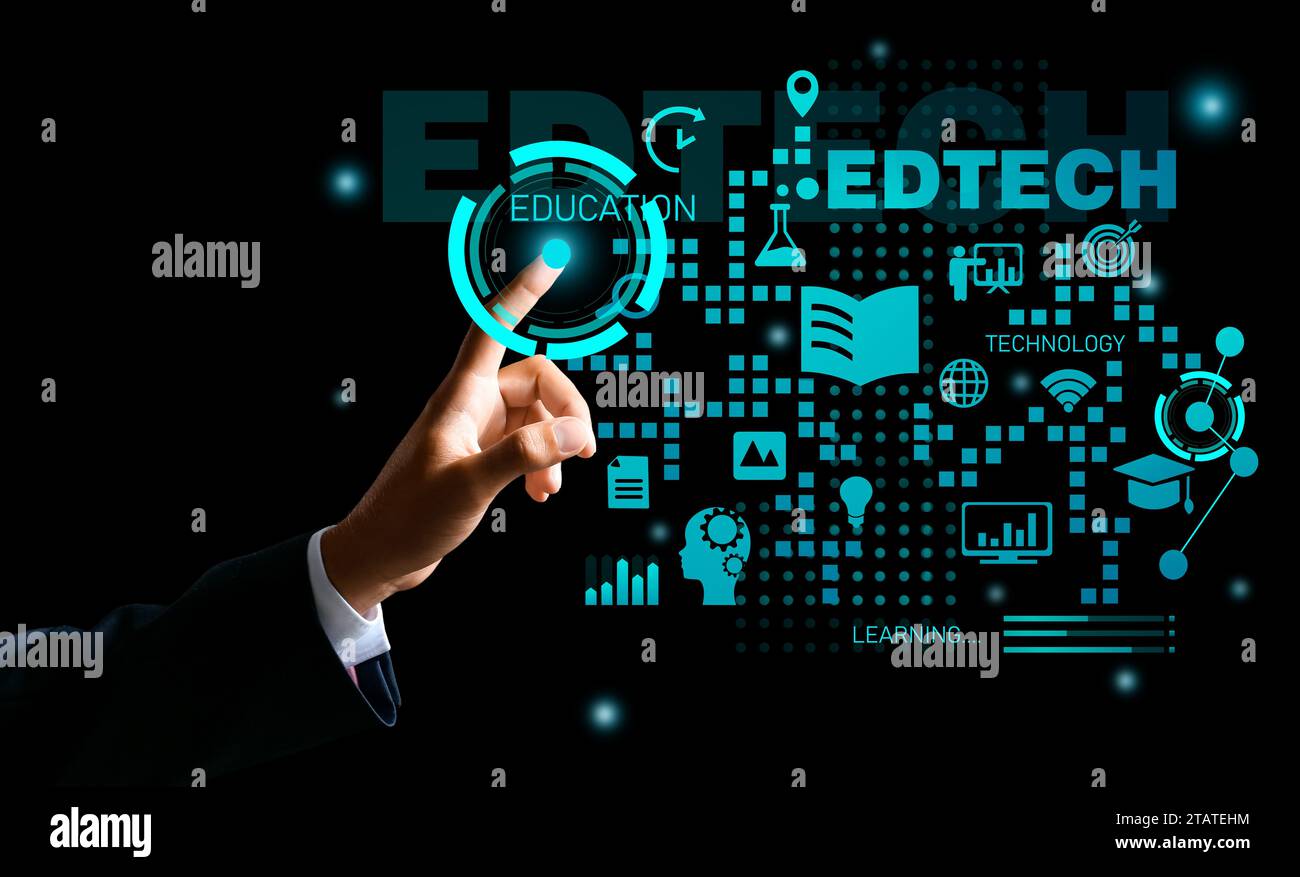 Man using virtual screen with text EDTECH on dark background Stock ...