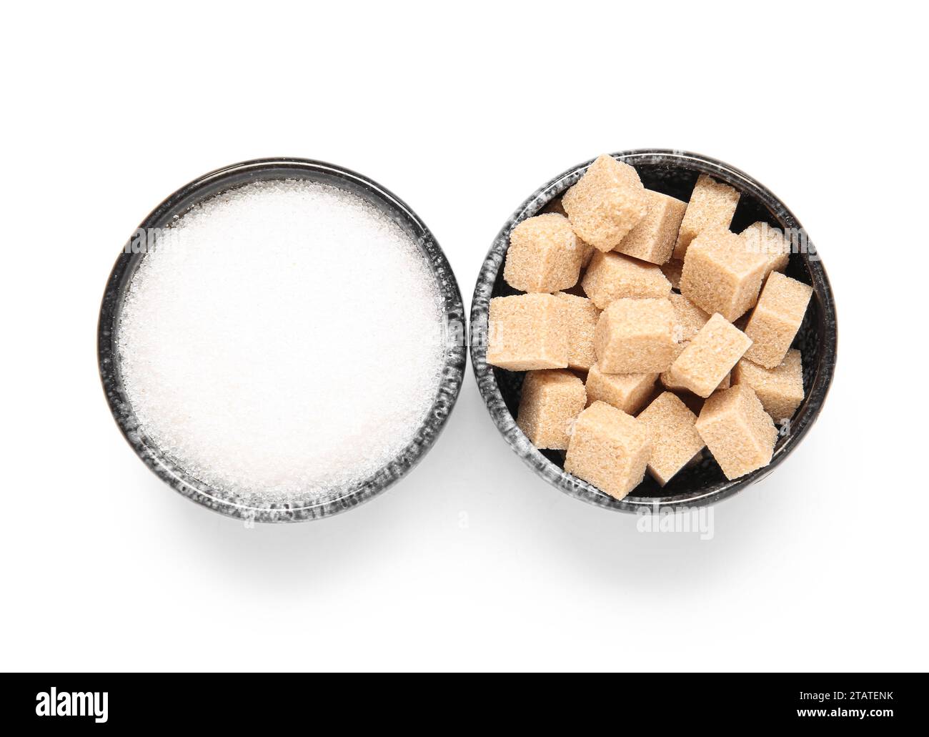 Bowls with different types of sugar on white background Stock Photo - Alamy