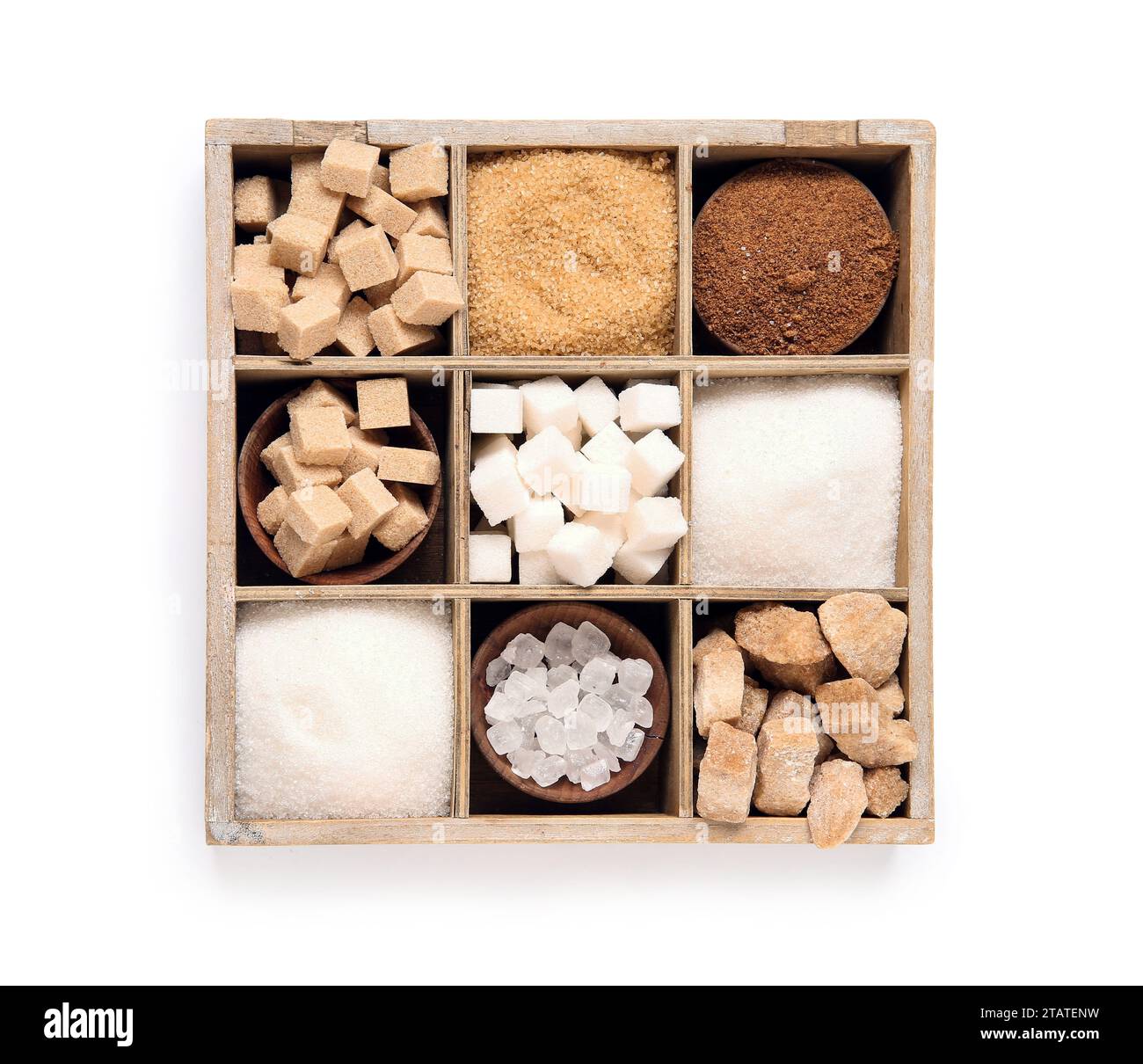 Wooden box with different types of sugar on white background Stock ...