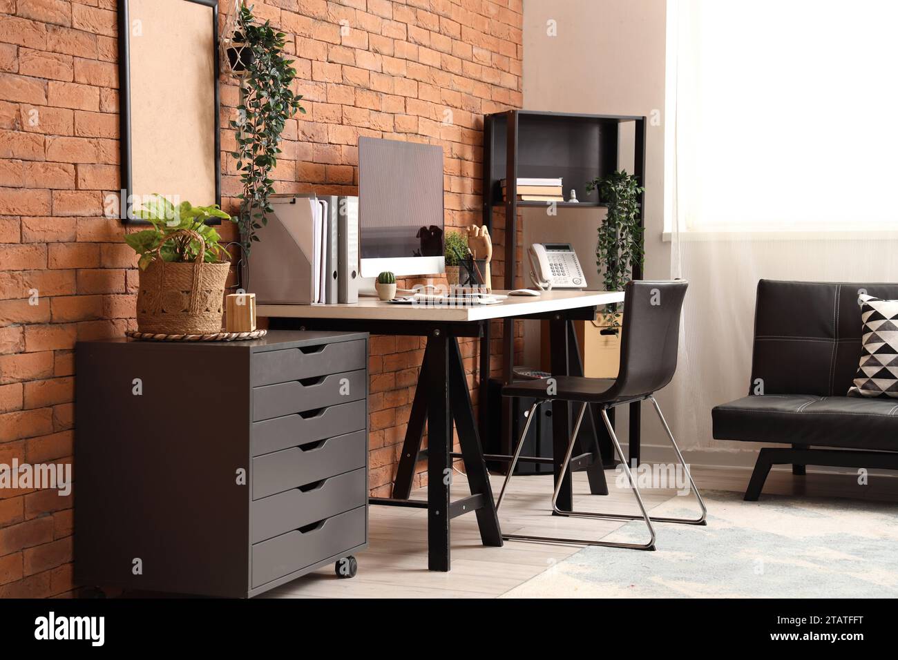 Interior of modern office with workplace, shelf unit and drawers Stock ...