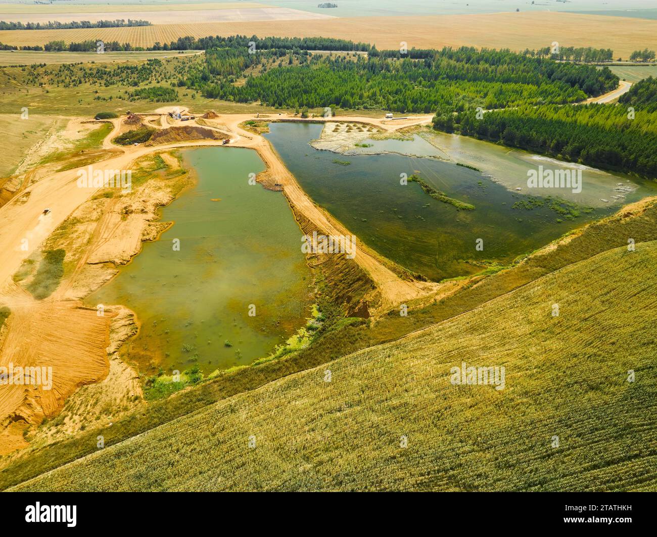 Open mining of construction sand from quarry by water ponds Stock Photo ...