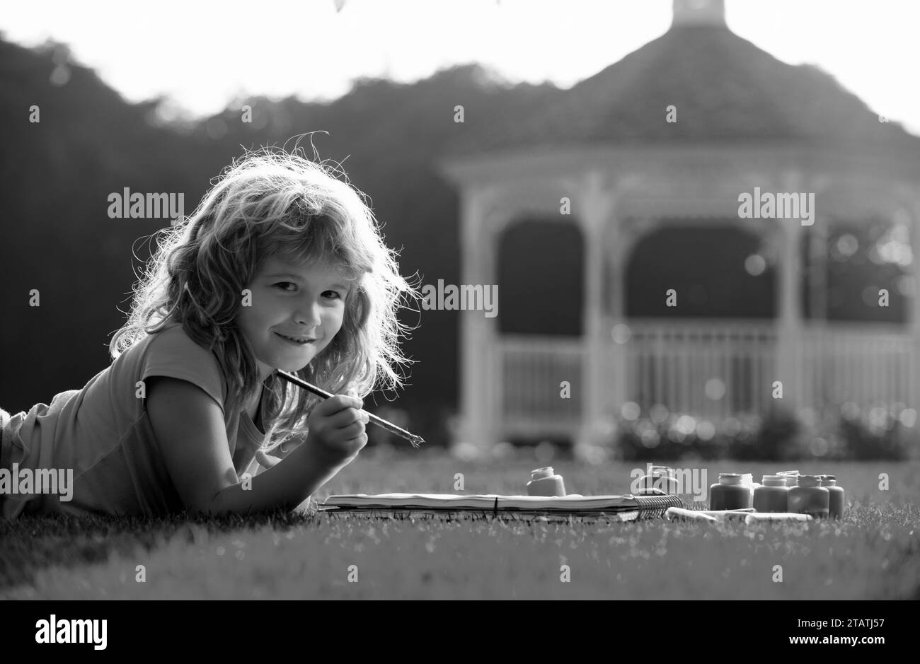 Children create artist paints creativity vacation. Child boy drawing in ...