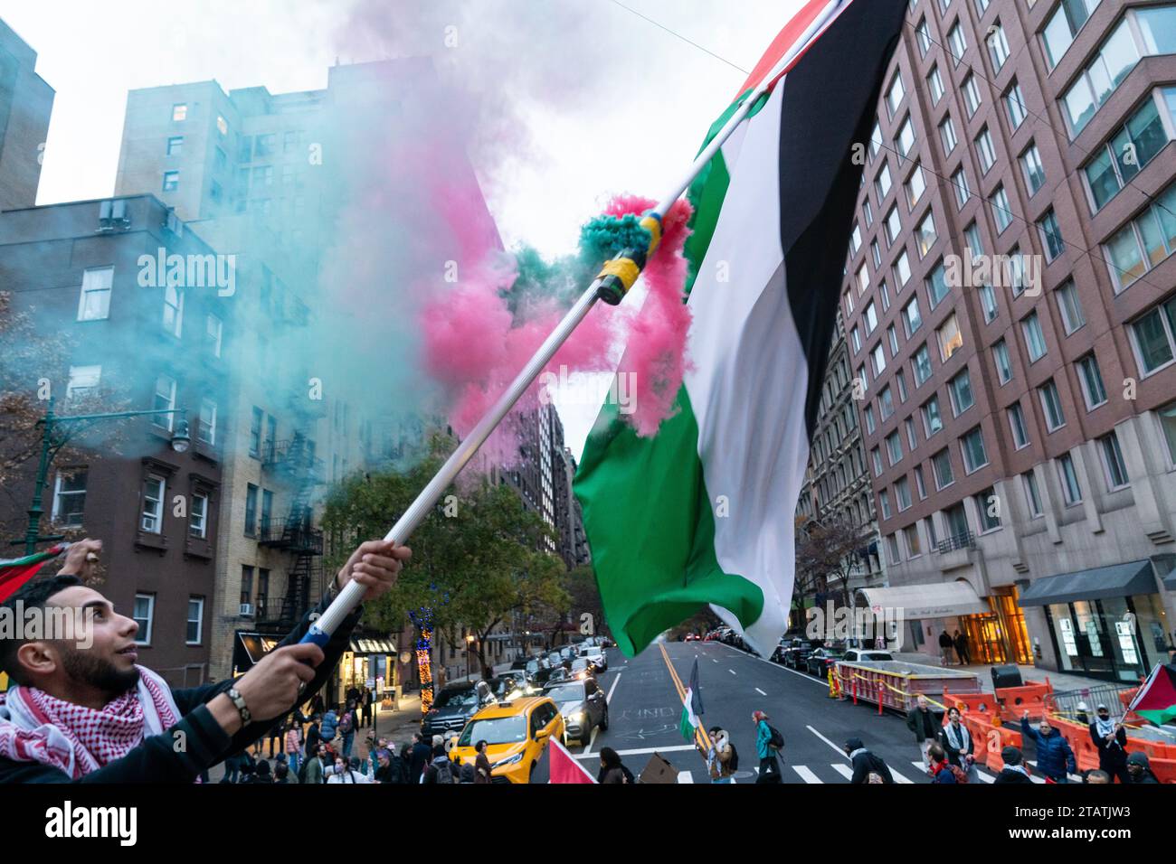 Flare in colors of Palestinian flag seen during march of pro ...
