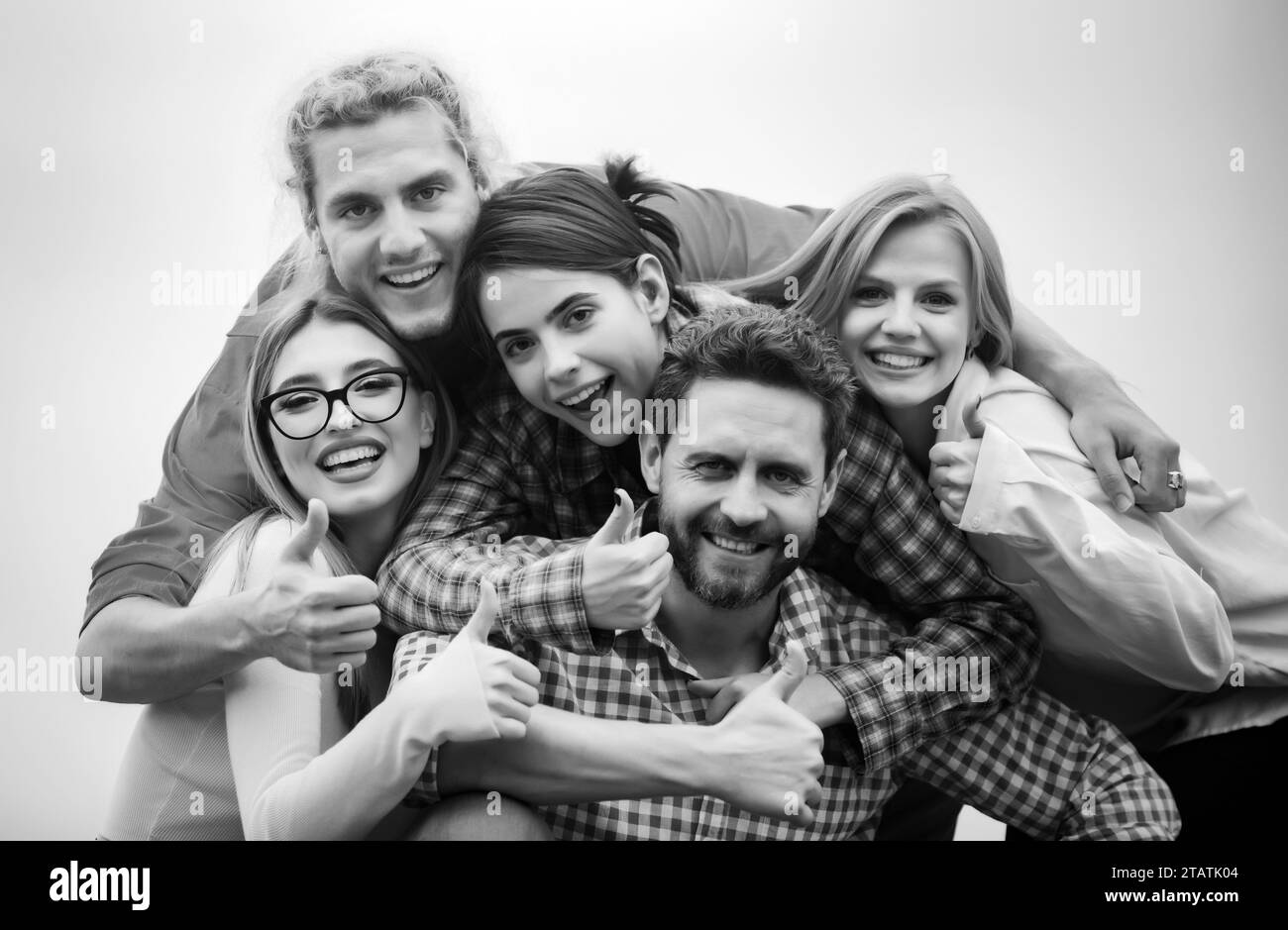 Happy company students best friends making selfies. Group young people posing together with ...