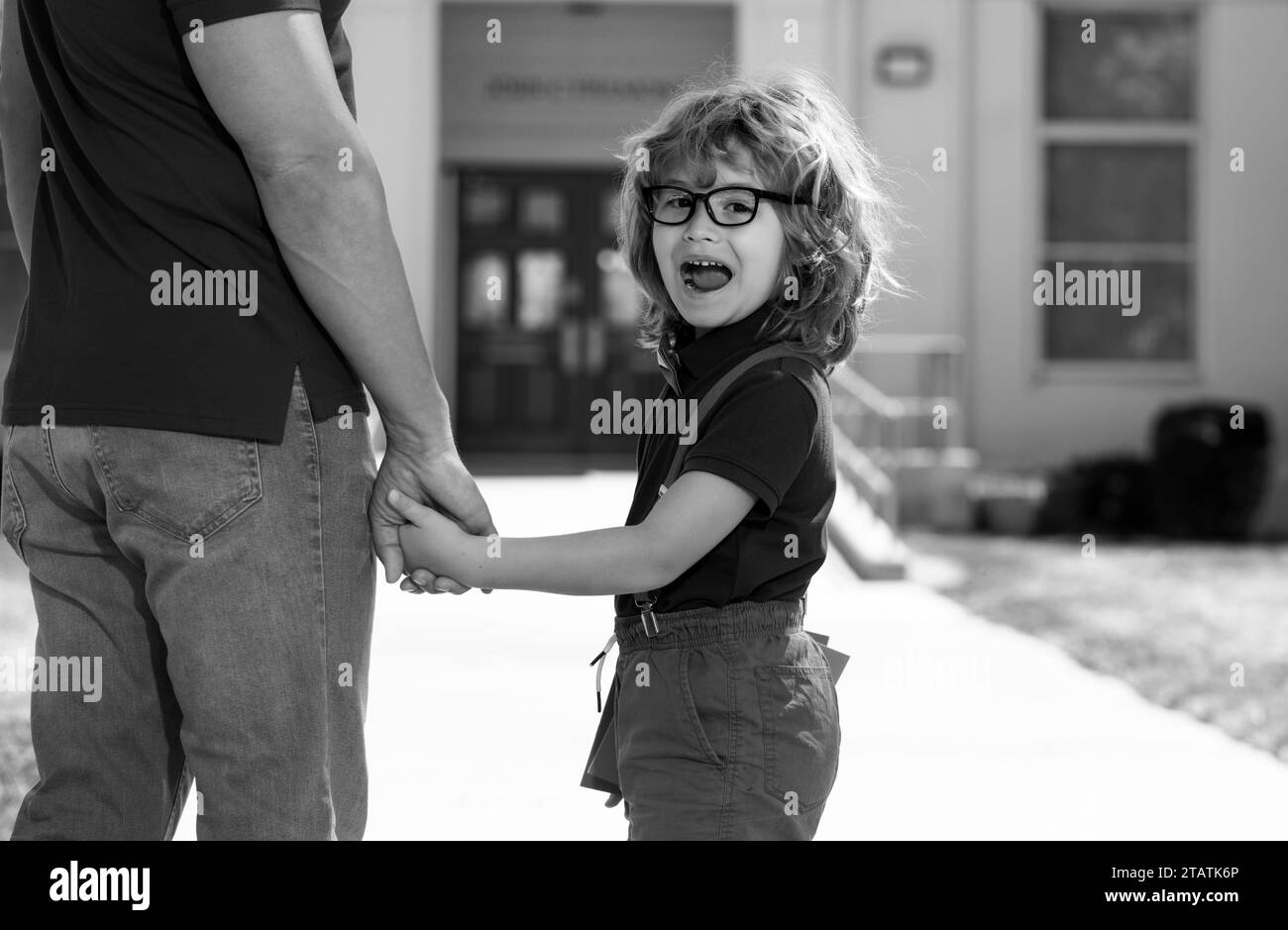 Father walking son to school. Parent and pupil of primary school ...