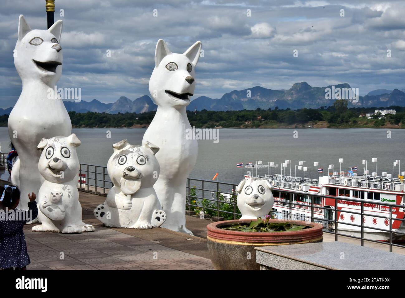 Cat and pig statues decorate the bank of the Mekong River at Nakhon ...
