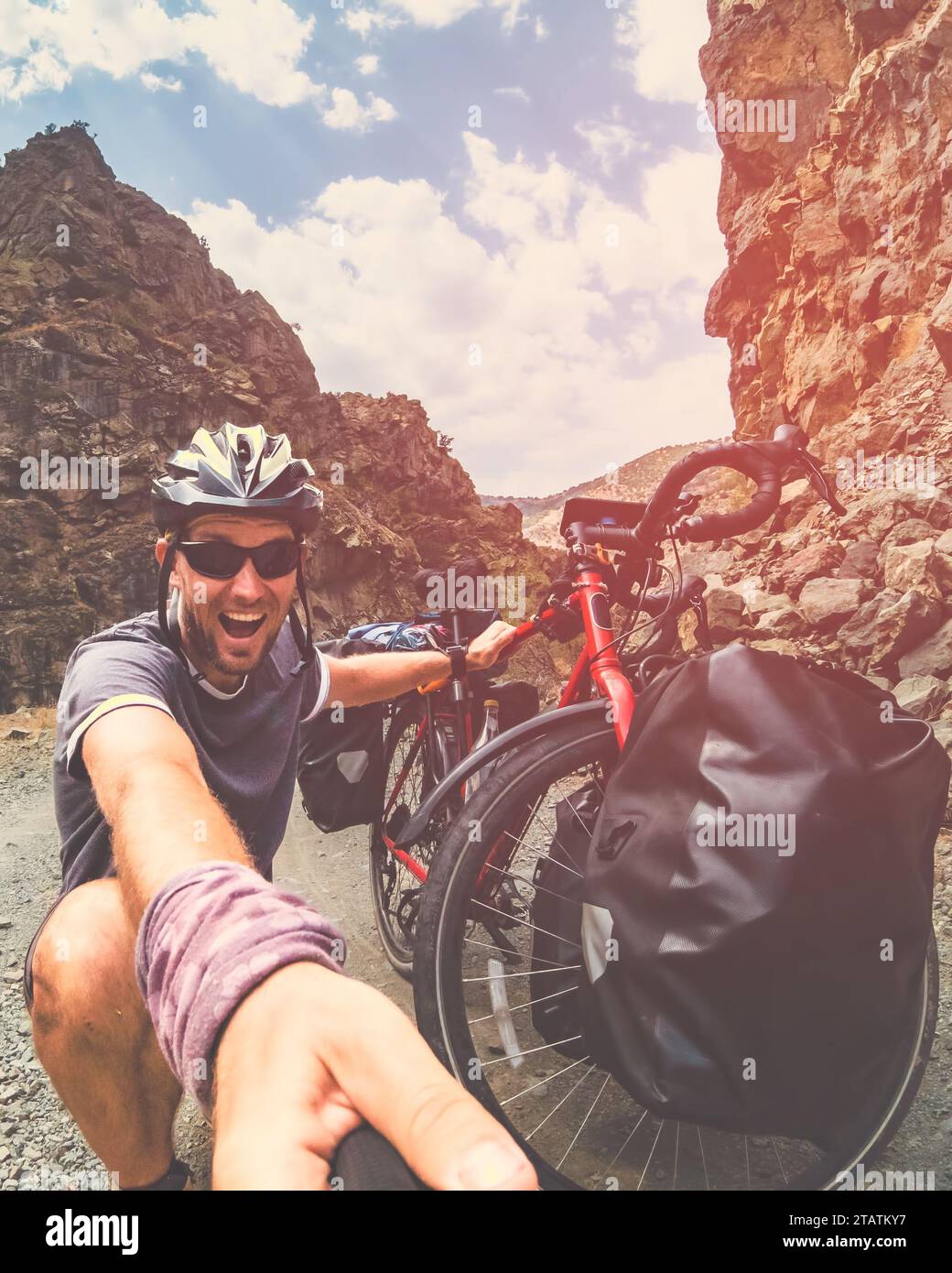 Male caucasian crazy cyclist by bicycle have funny expression outdoors ...