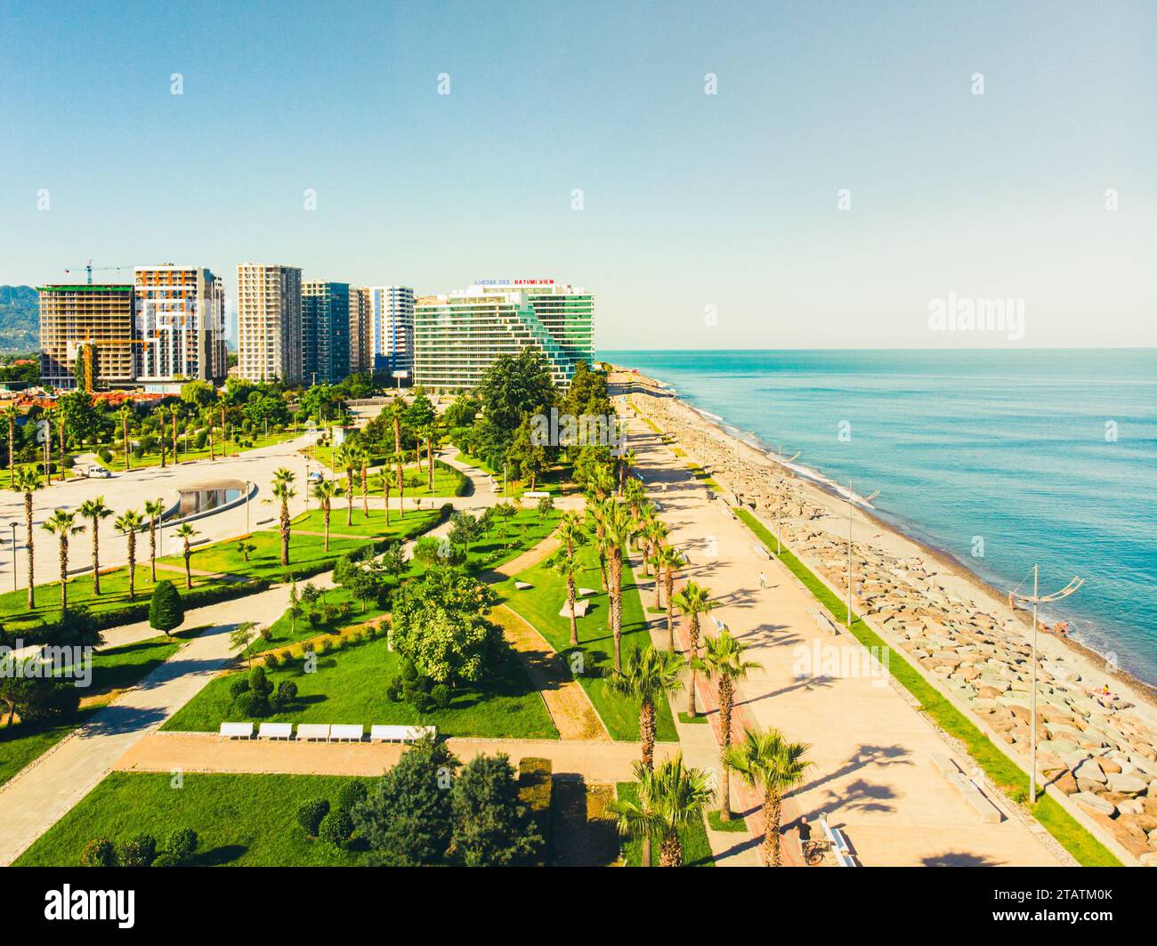 Aerial panoramic view of beautiful Batumi beach in sunny summer weather ...