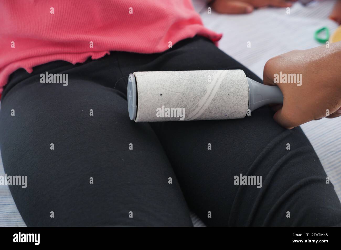 cleaning child clothes with clothes roller Stock Photo - Alamy