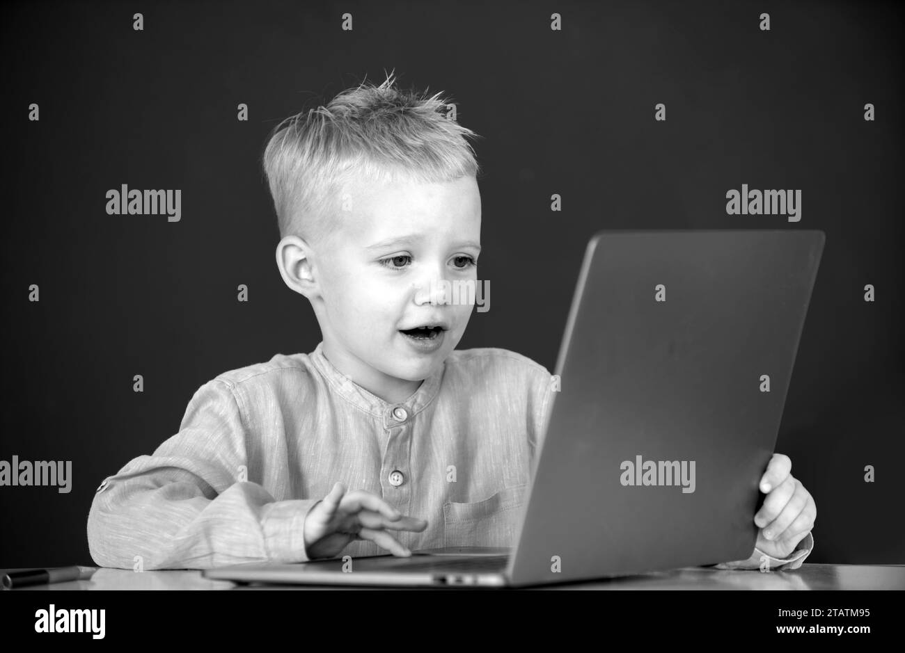 Boy reading in class Black and White Stock Photos & Images - Alamy