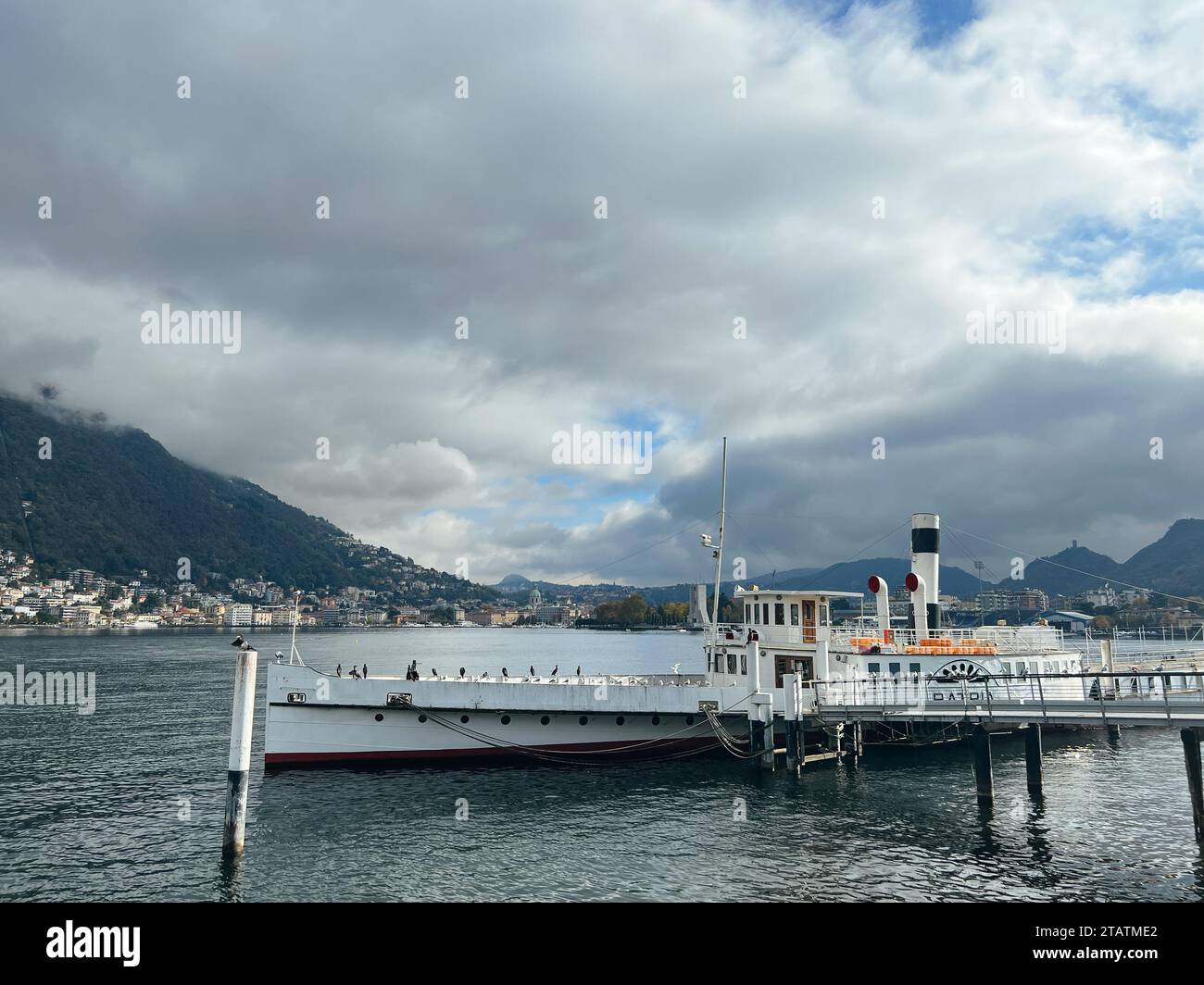 Como, Italy - 12 november 2023: Small ship is moored at the pier on ...