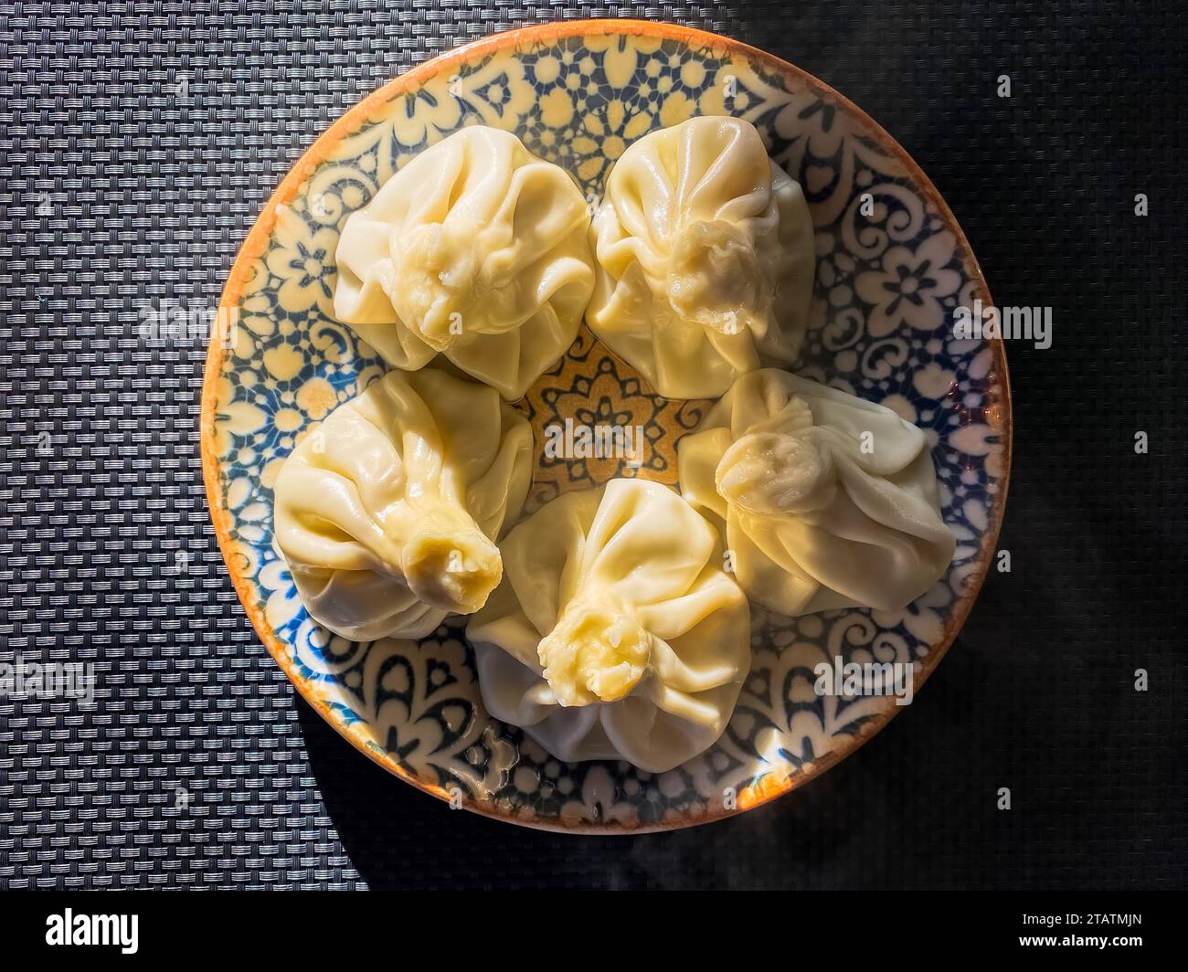 Top view traditional Georgian dish, steaming hot delicious khinkali ...