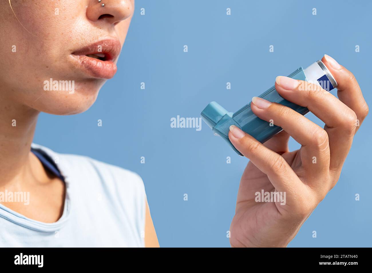 Woman using asthma inhaler during asthma attack Stock Photo - Alamy