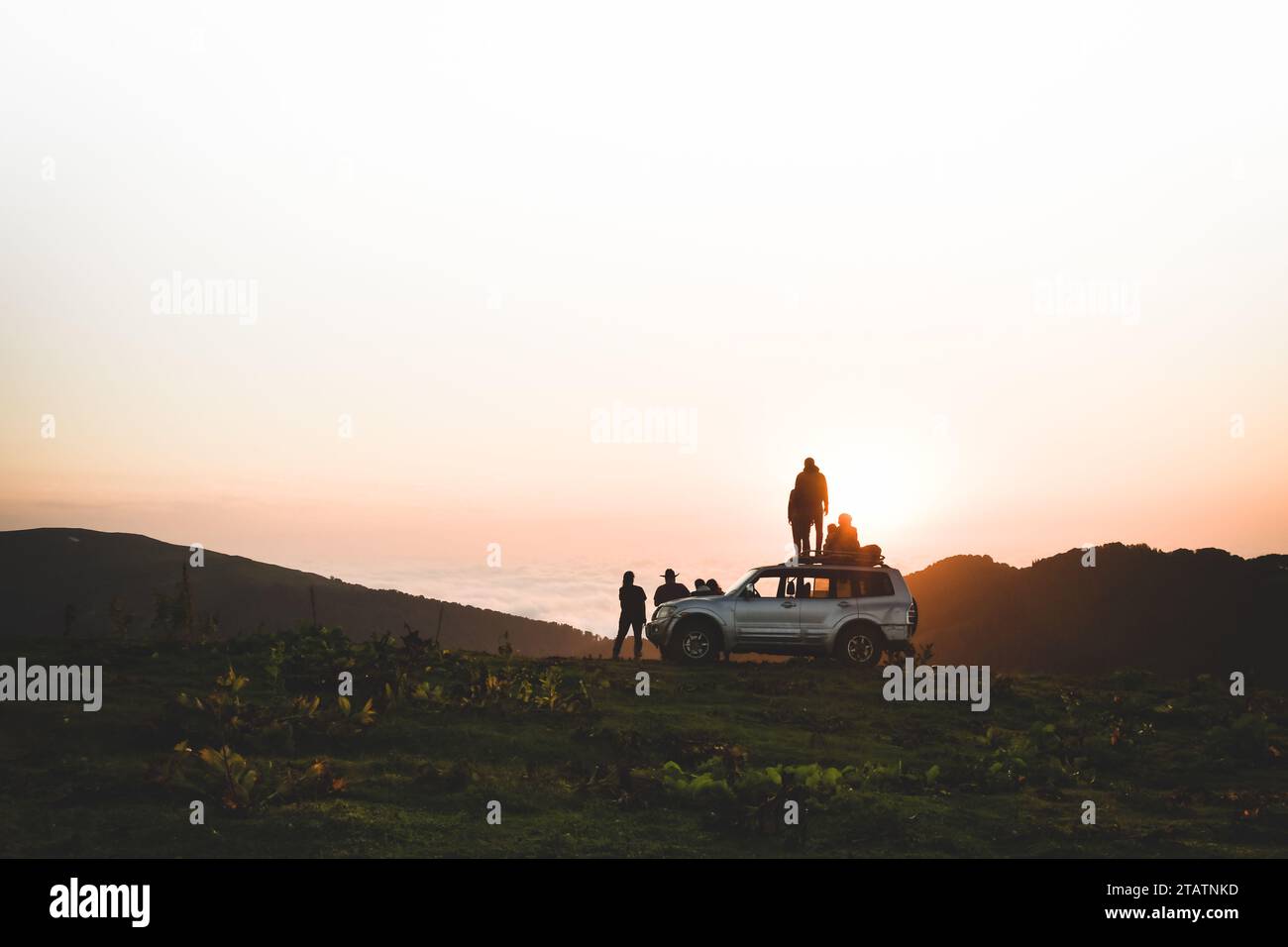 Group of travelers tourist stand by 4wd vehicle together in nature on ...