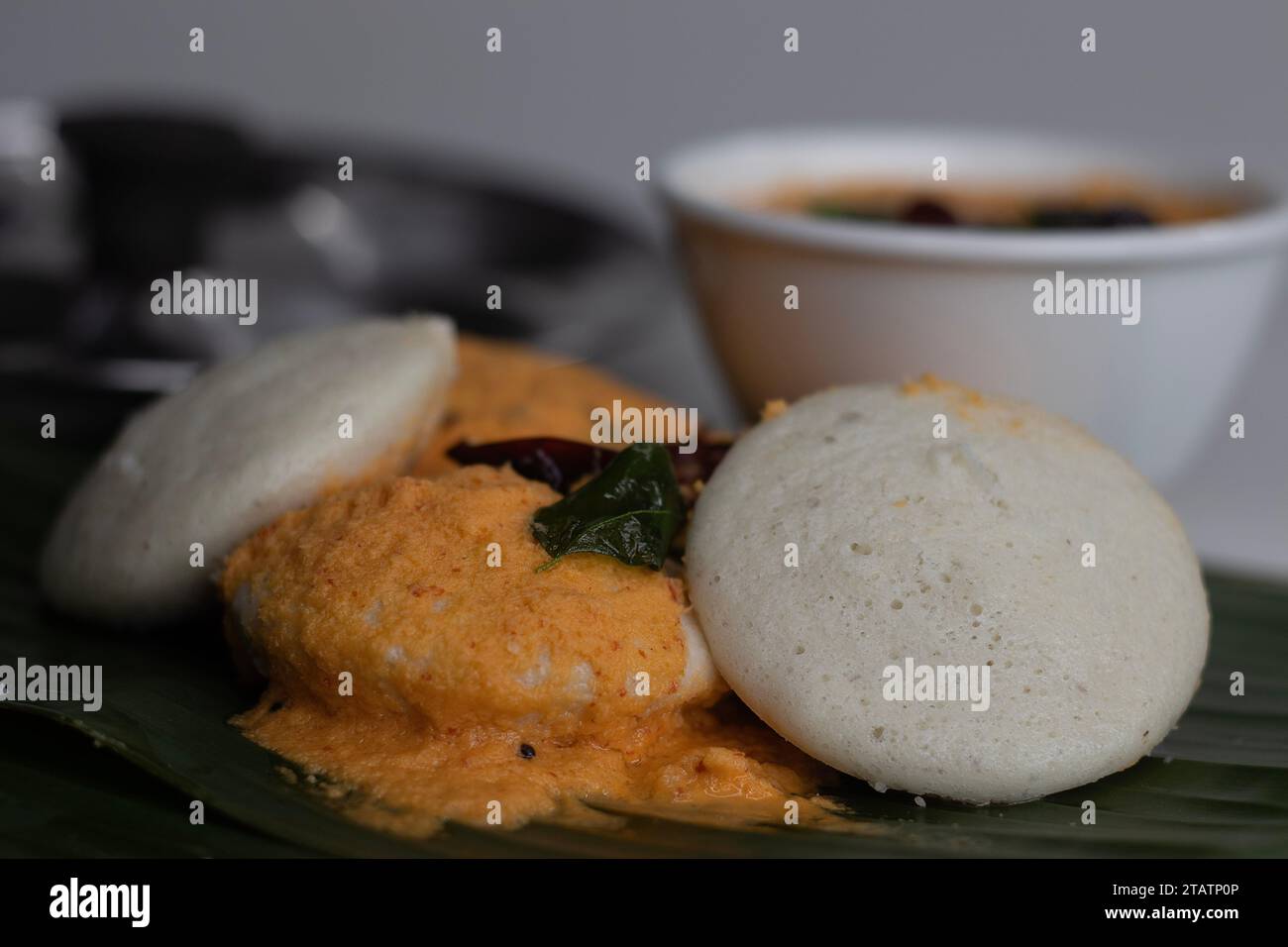 Idly with Coconut chutney. Steamed savory rice cake made with a batter ...