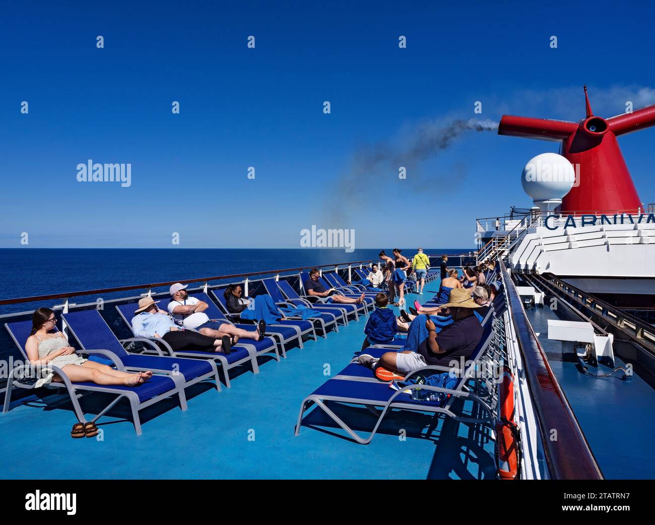 South Pacific Cruise / Cruise ship passengers relaxing on the deck of ...