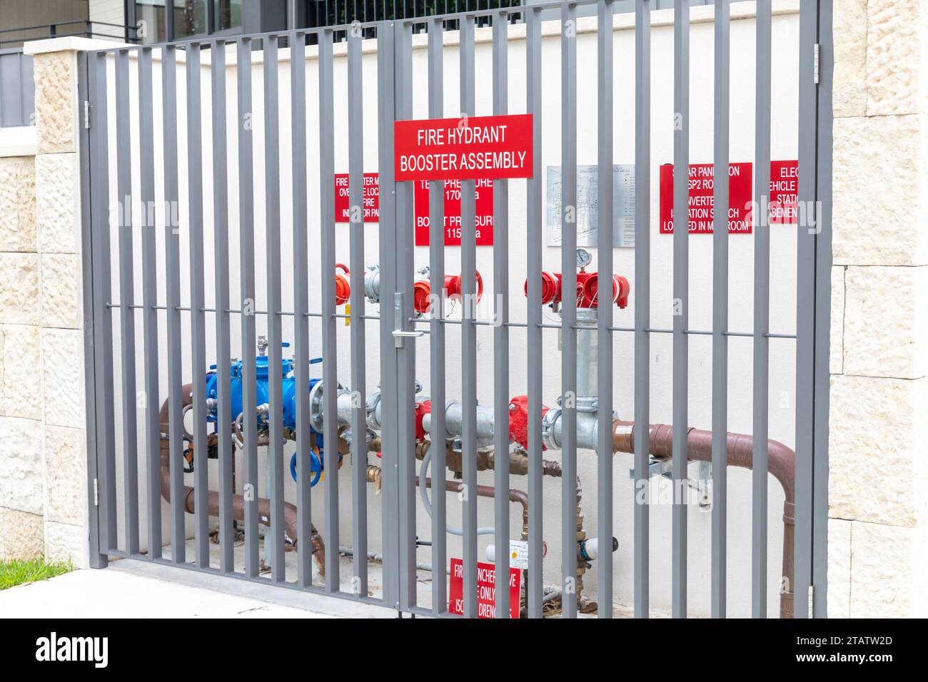 Australia, fire hydrant booster supply behind gates at a new apartment ...