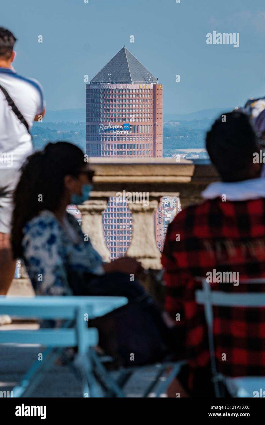 Tourists taking photos of the famous Part-Dieu Tower, nicknamed 'le ...
