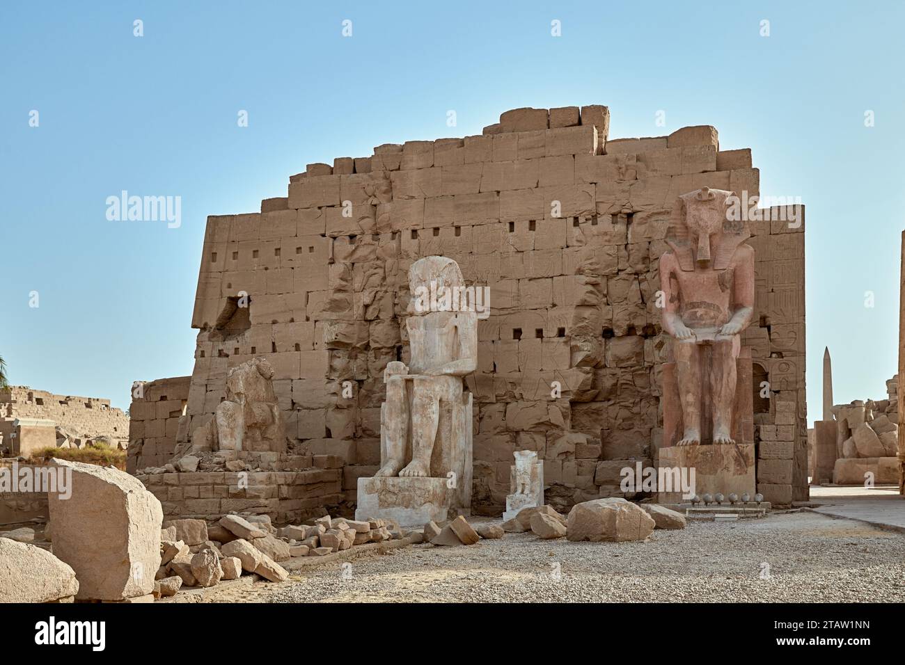 Three male figures standing side by side in a row, facing forward with ...