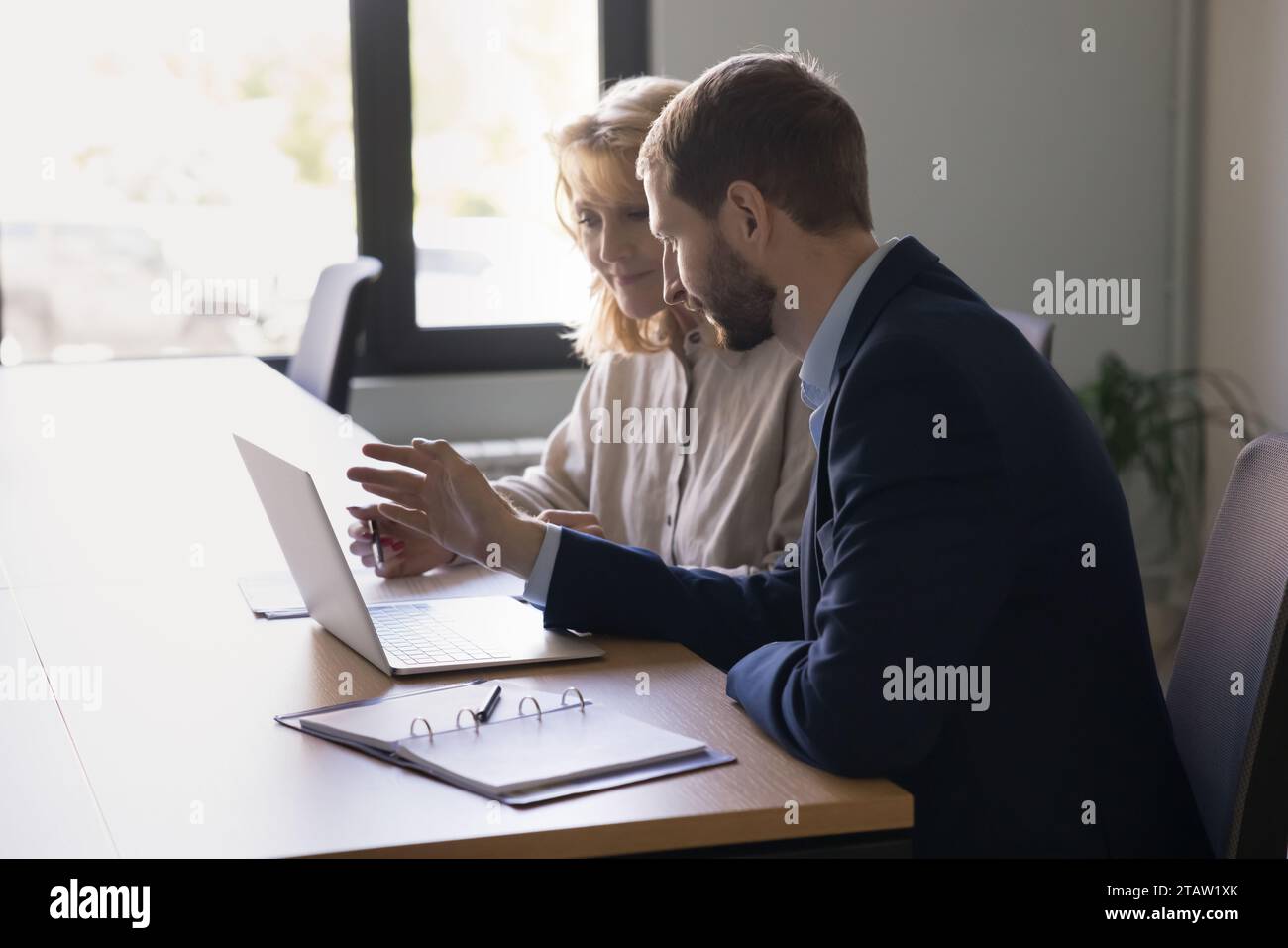 Teammates engaged in teamwork, prepare presentation, working on joint ...