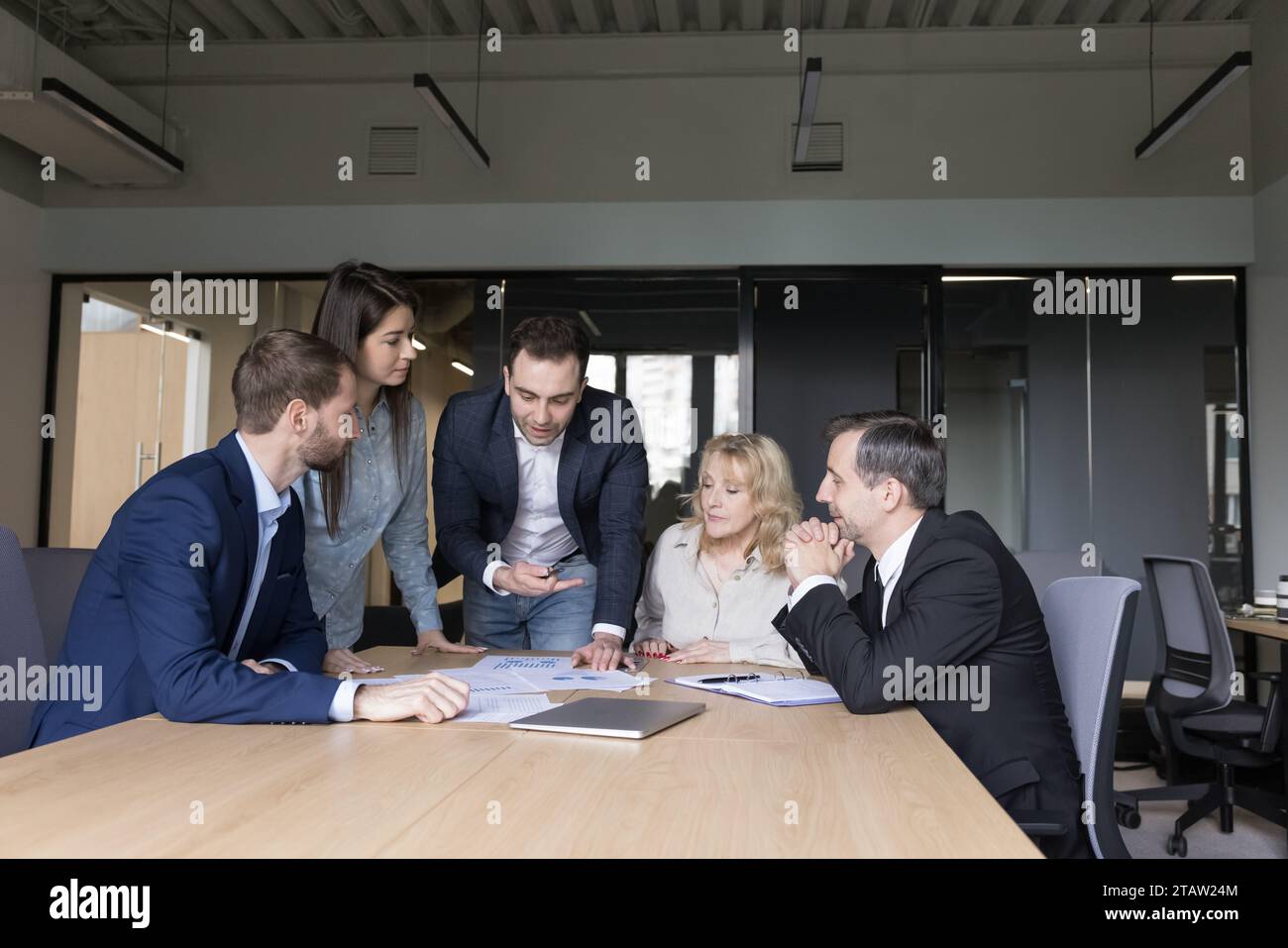 Employees review sales statistics shown in graphs and charts Stock ...