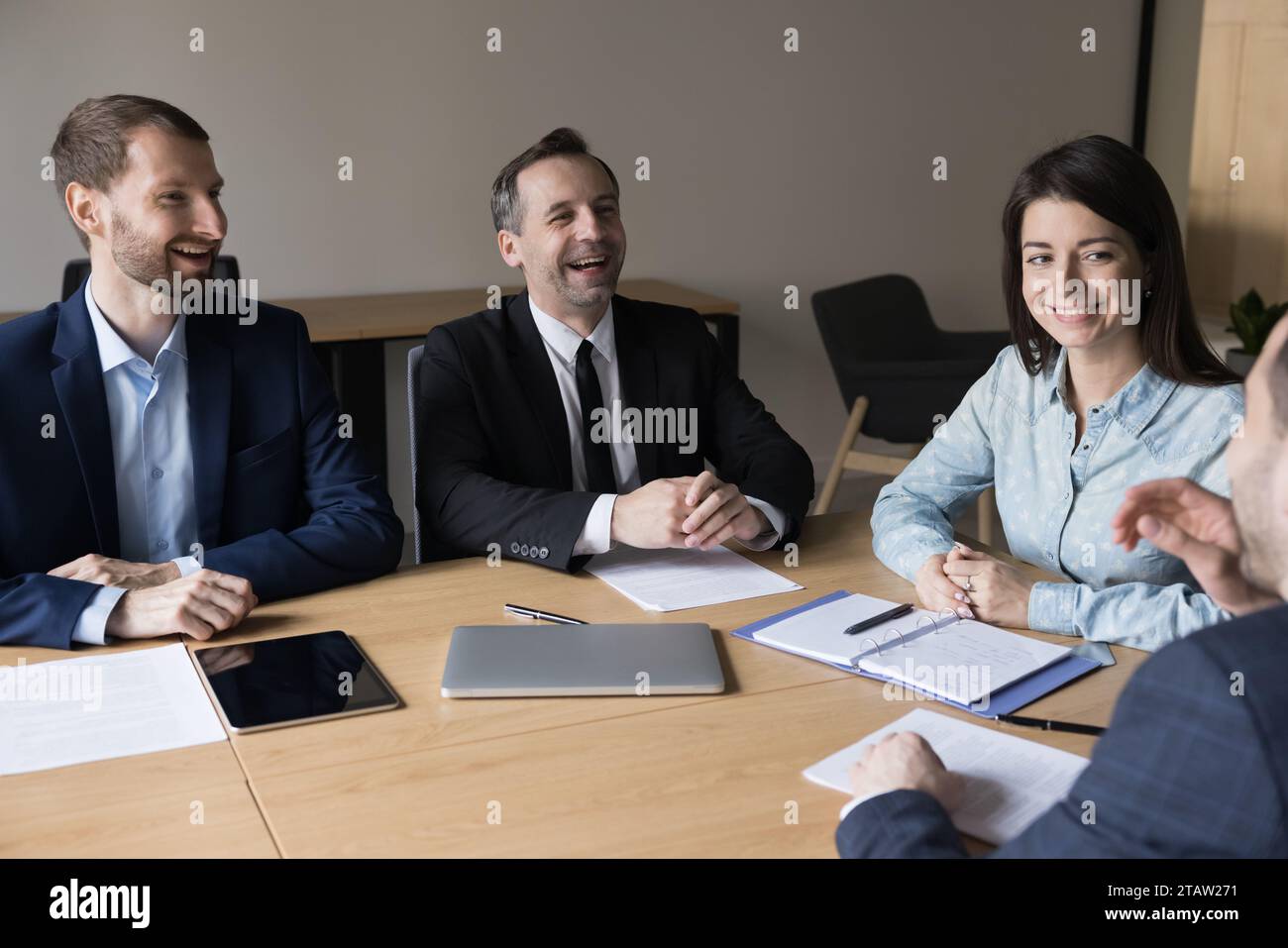 Positive employees laughing, joking enjoy friendly relationships and ...