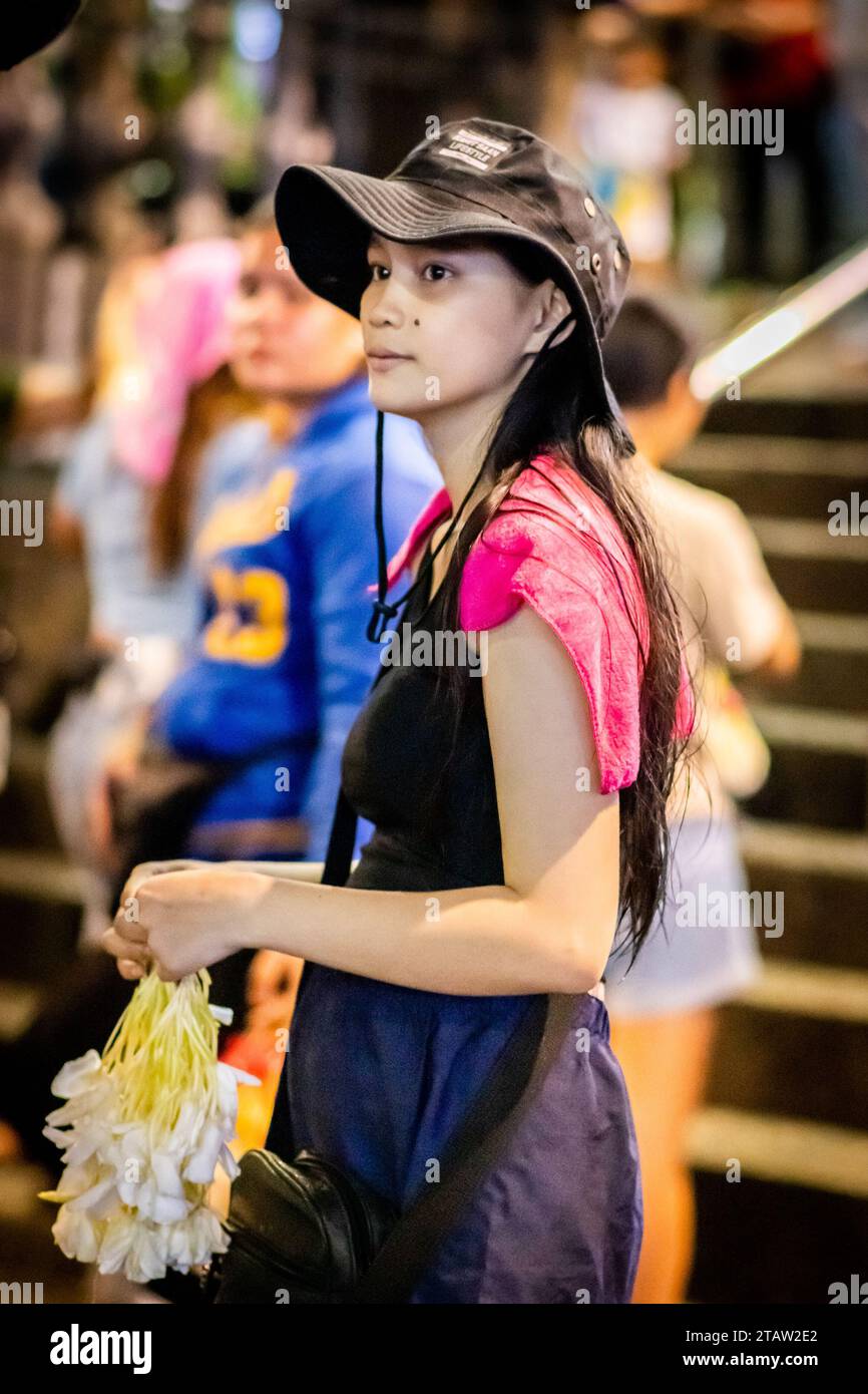 A pretty young Filipino girl sells flower garlands at Santo Nino de ...