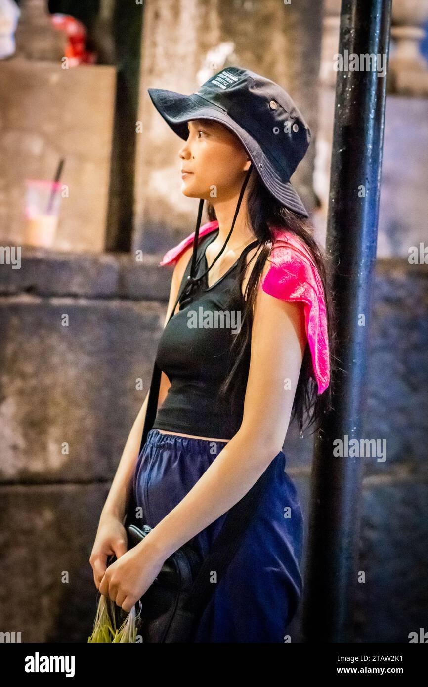 A pretty young Filipino girl sells flower garlands at Santo Nino de ...